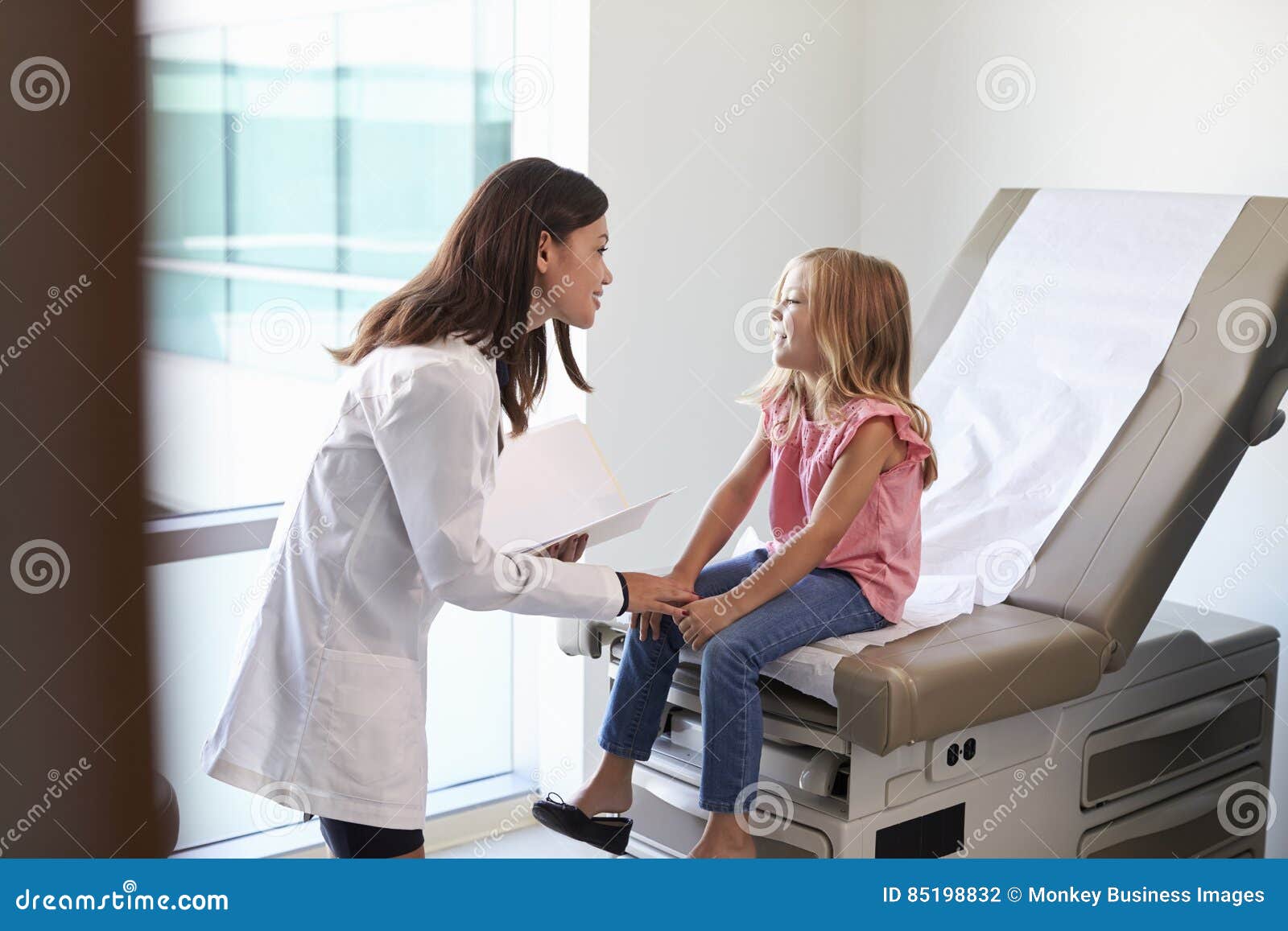 Pediatrician in White Coat with Child in Exam Room Stock Photo - Image ...