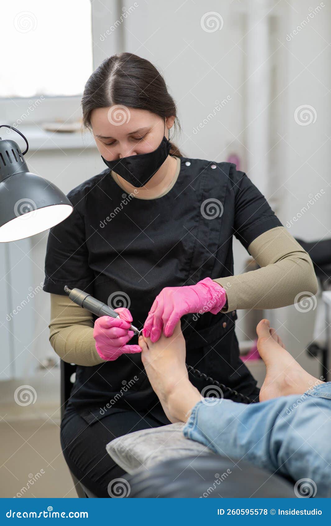 The Pedicure Master Processes the Client& X27;s Foot Using an Apparatus ...