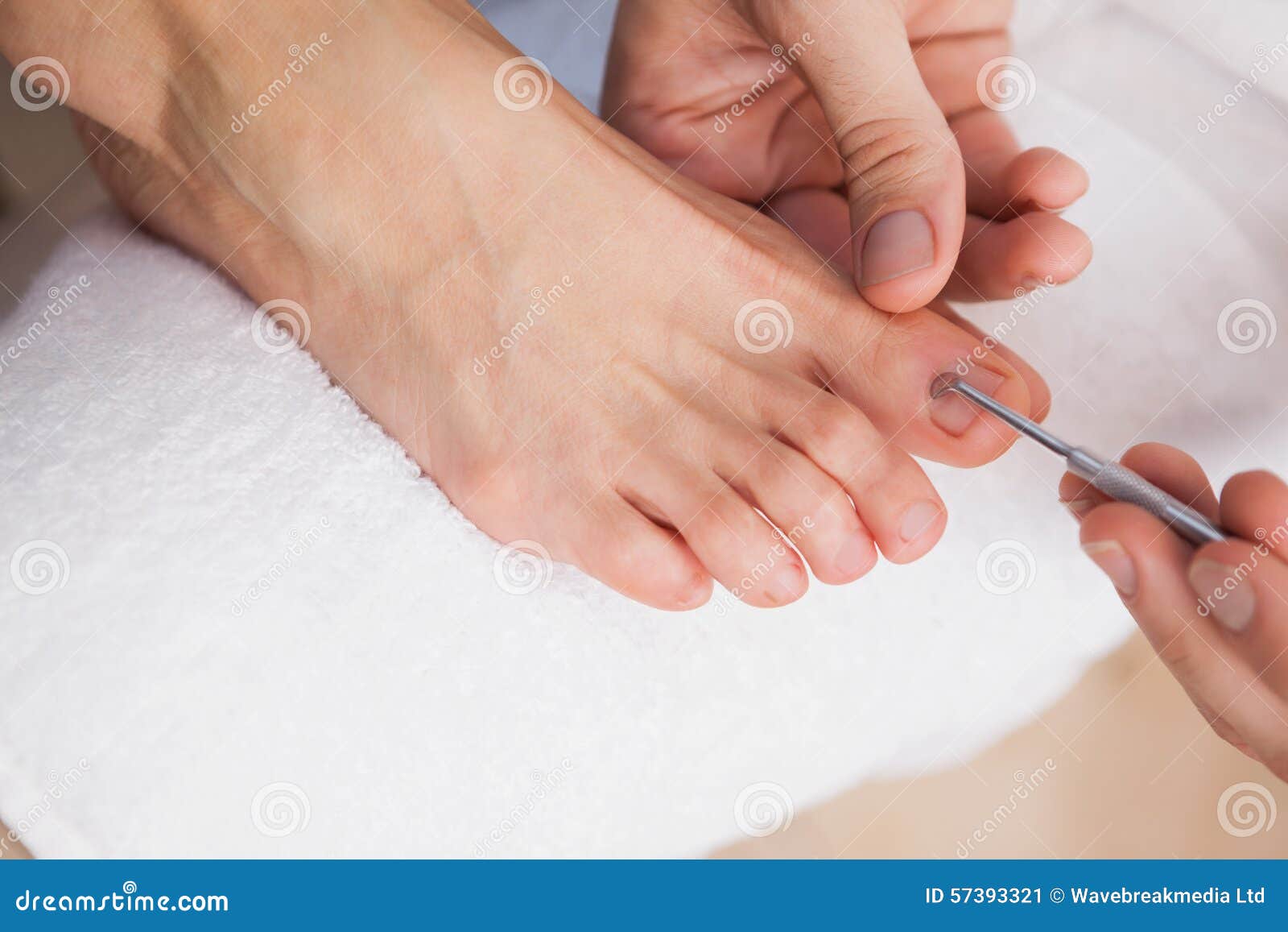 Pedicurist Cleaning a Customers Toe Nails Stock Image - Image of ...