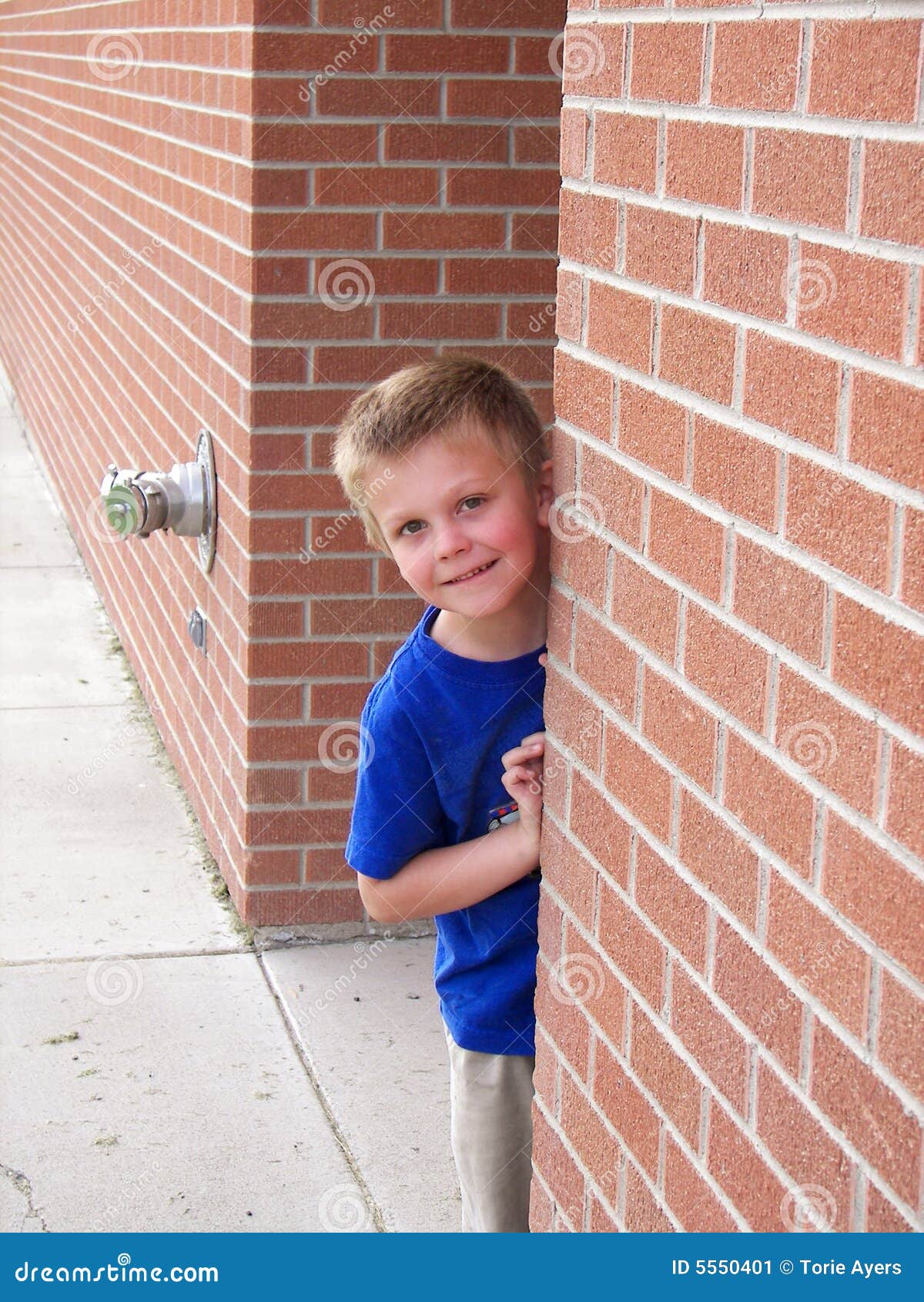 Child Peeking Around Corner