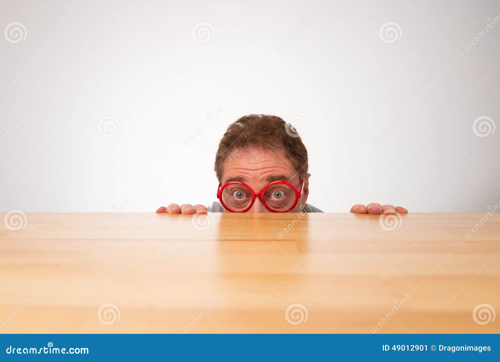 Peeking over the table stock image. Image of professional - 49012901