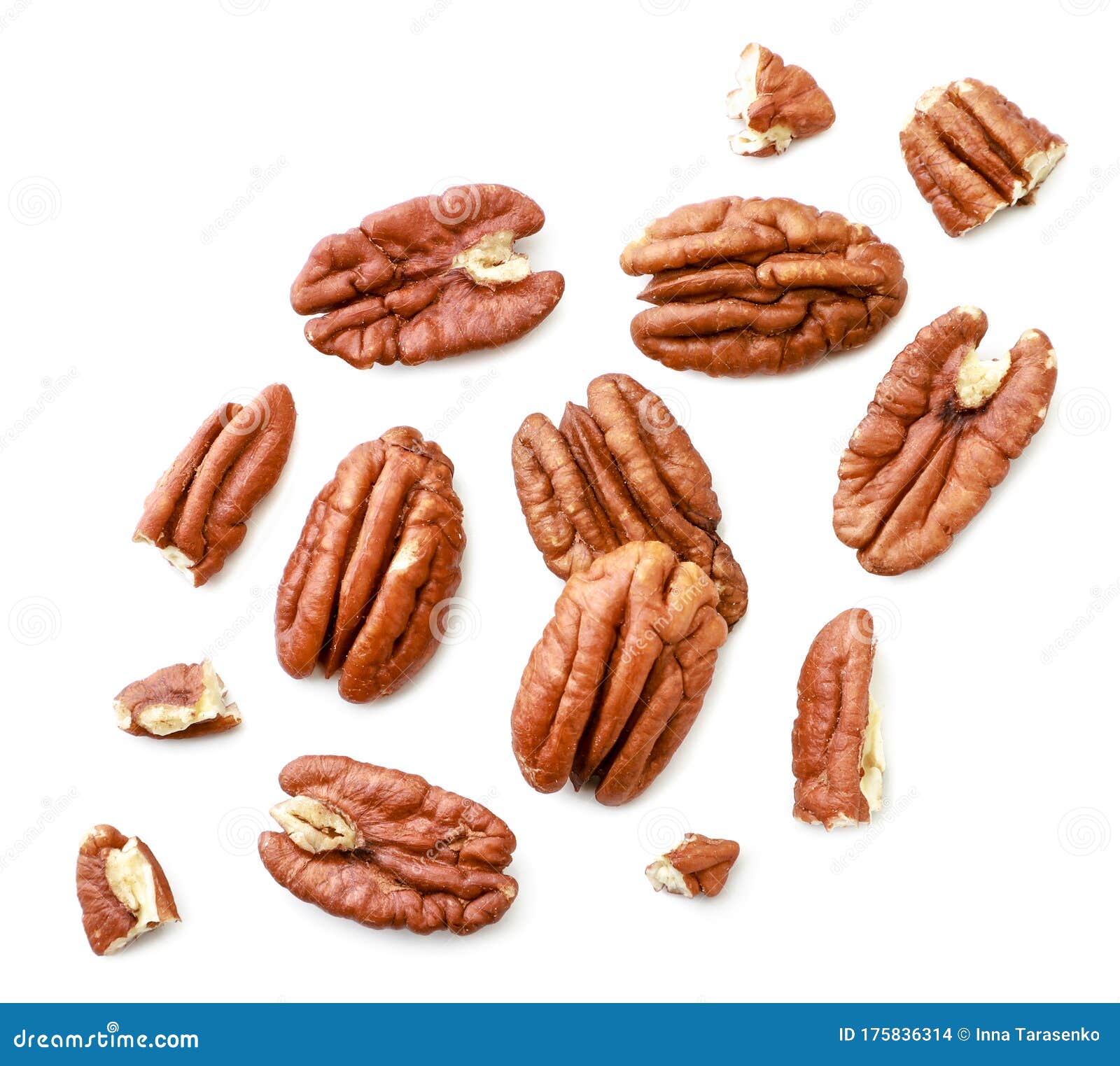 Peeled Pecans with Broken Halves and Pieces on a White Background. the ...