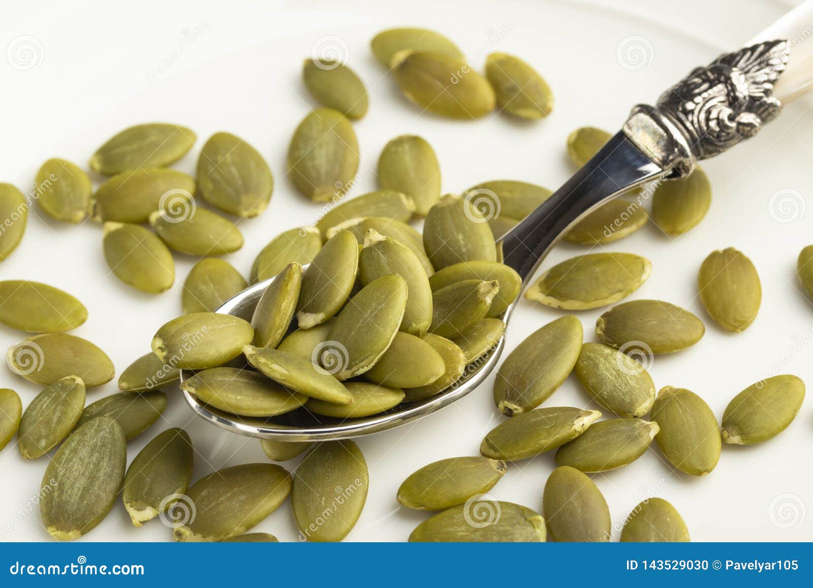 Peeled Pumpkin Seeds on a Dessert Spoon Stock Photo - Image of ...