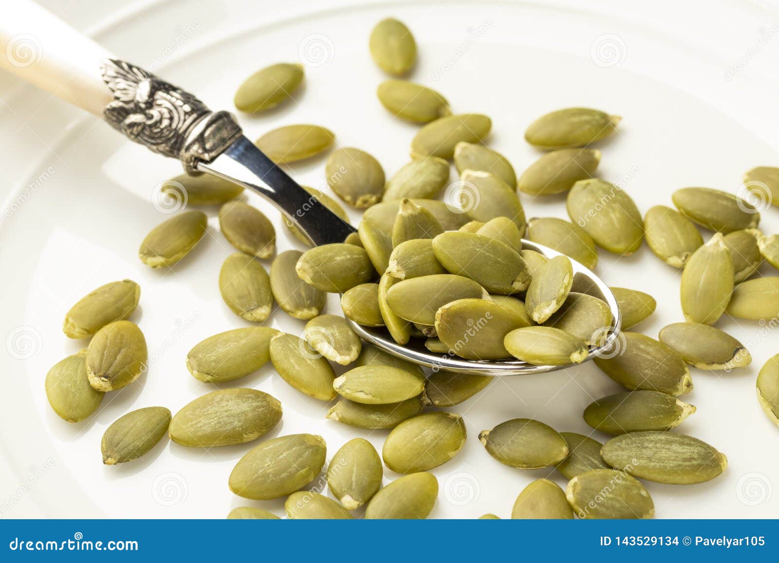 Peeled Pumpkin Seeds on a Dessert Spoon Stock Photo - Image of pumpkin ...
