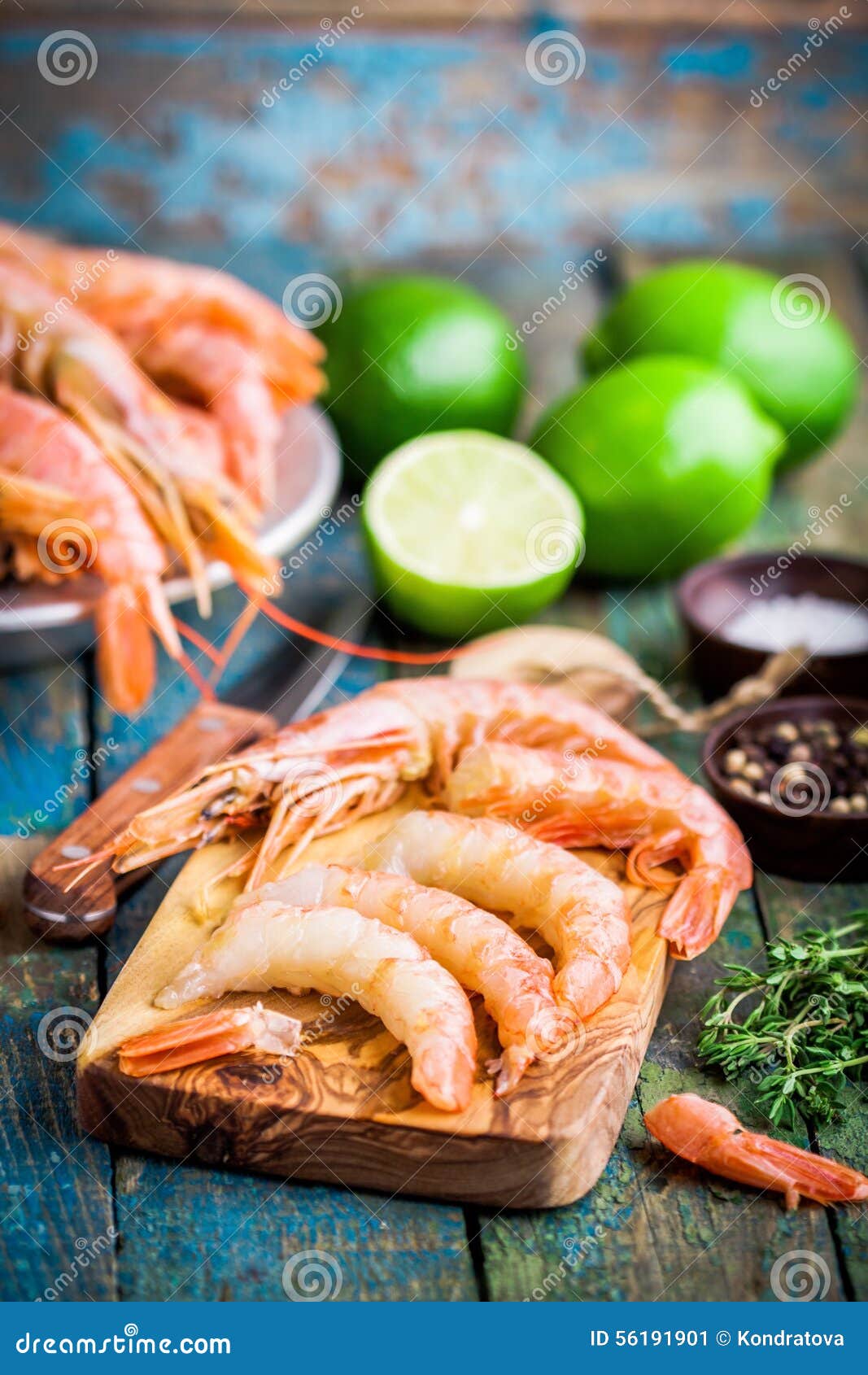 Peeled Raw Prawns on a Wooden Cutting Board with Salt, Pepper, Lime ...