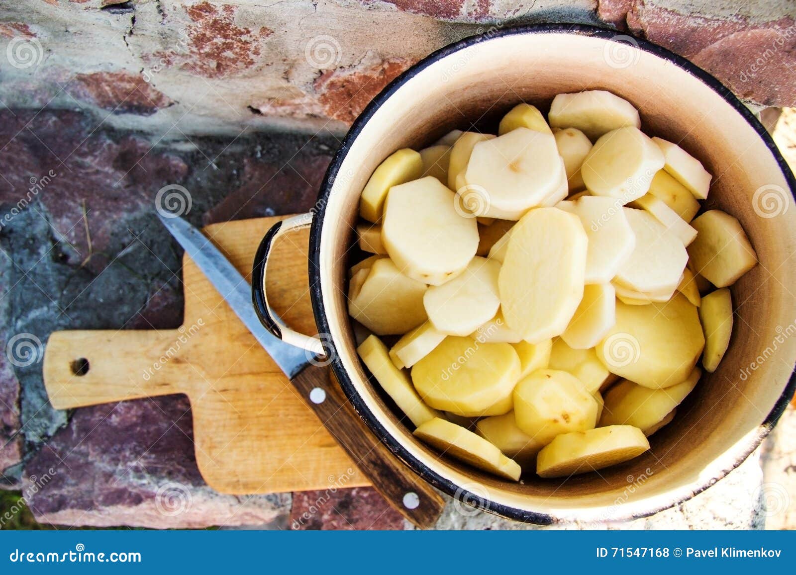 Peeled Sliced Potatoes in a Pot on a Background of Stone Table Stock ...
