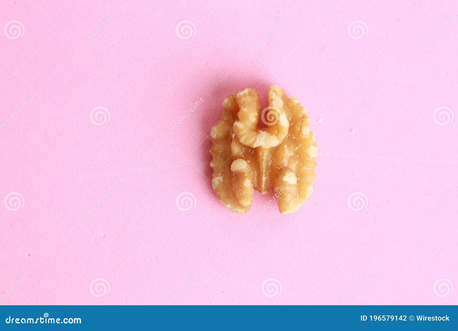 Peeled Walnut on a Pink Surface Stock Photo - Image of tasty, natural ...