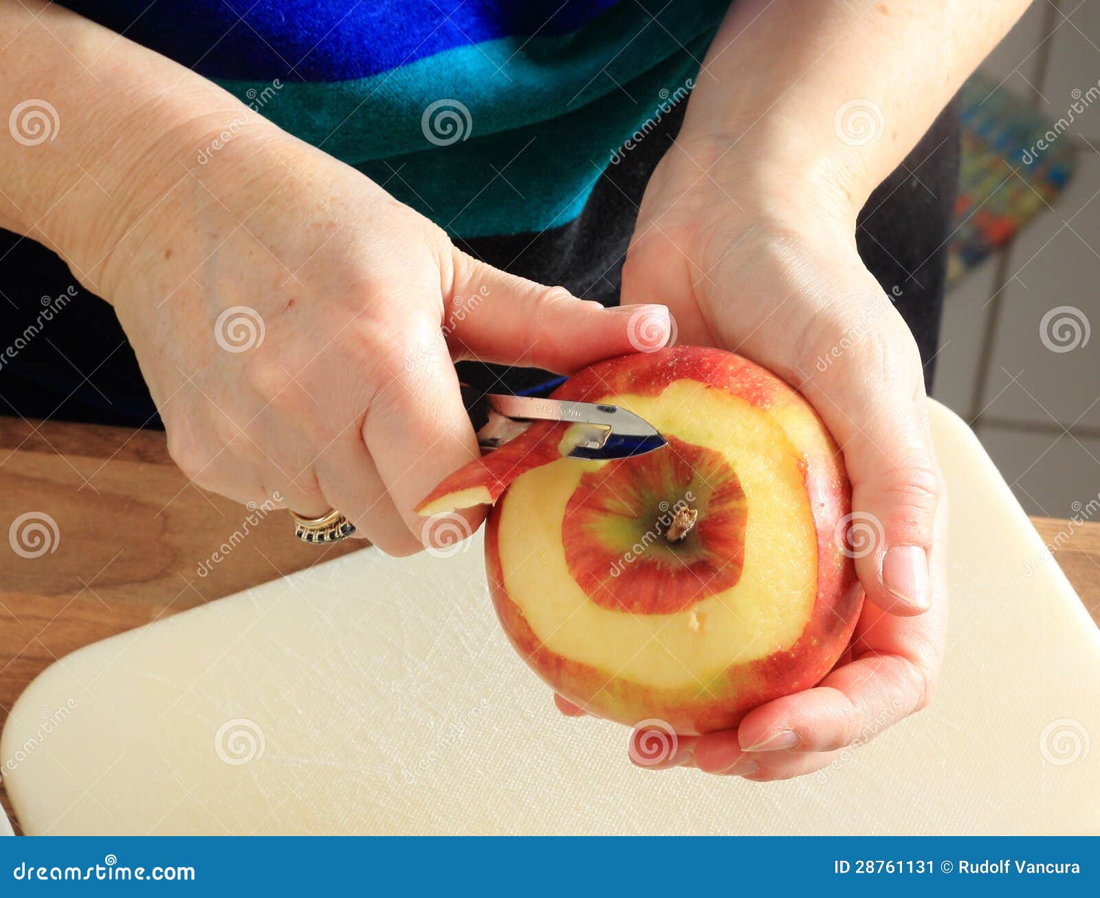 Peeling an Apple stock image. Image of hands, peels, holds - 28761131