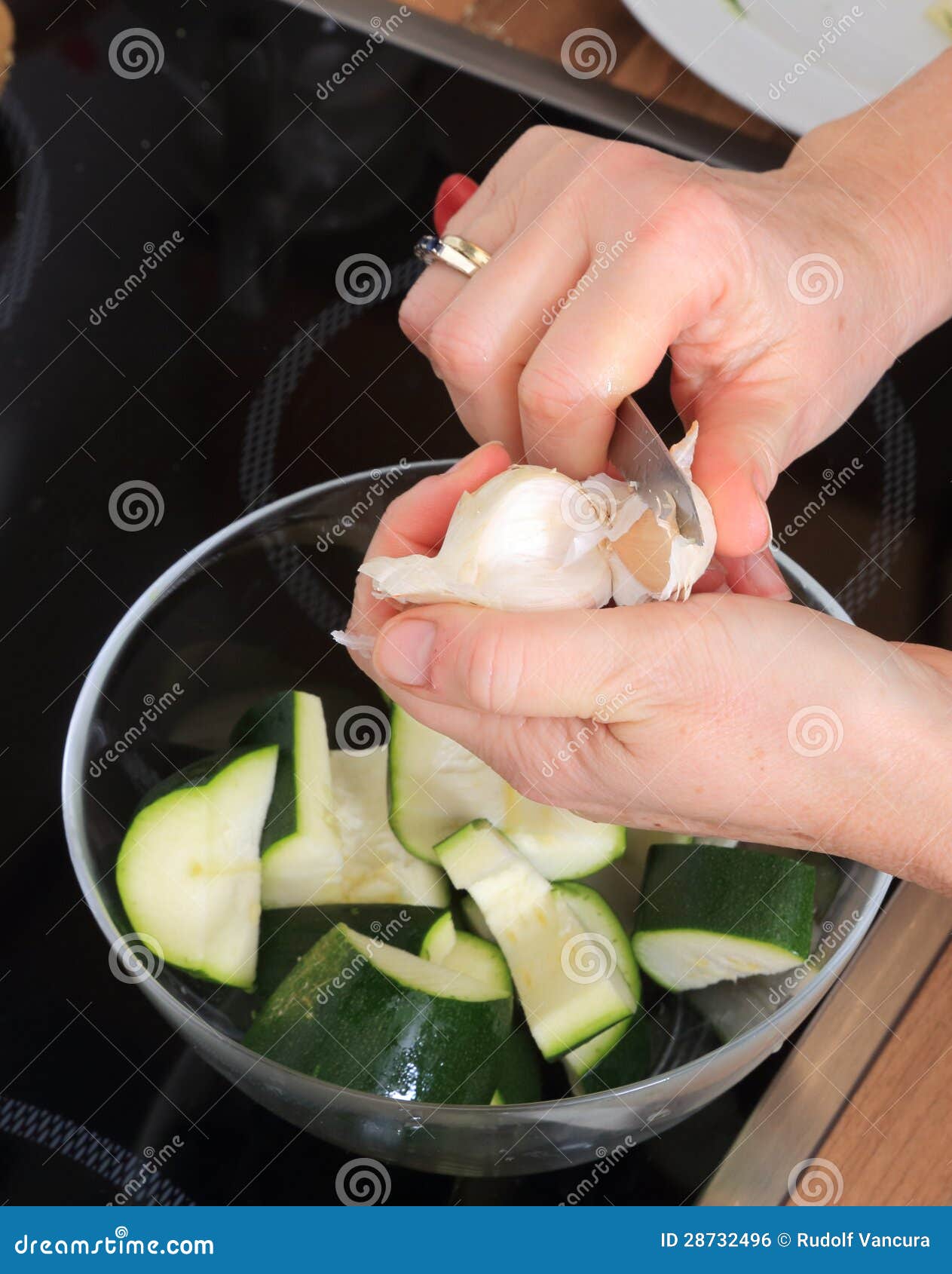 Peeling a clove of garlic stock photo. Image of eating - 28732496