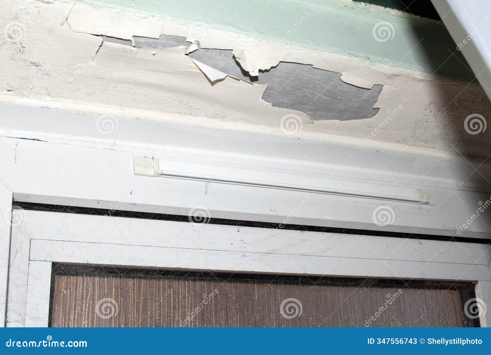 Peeling Damaged Flaking and Falling Down Paint on a Ceiling in a Damp ...