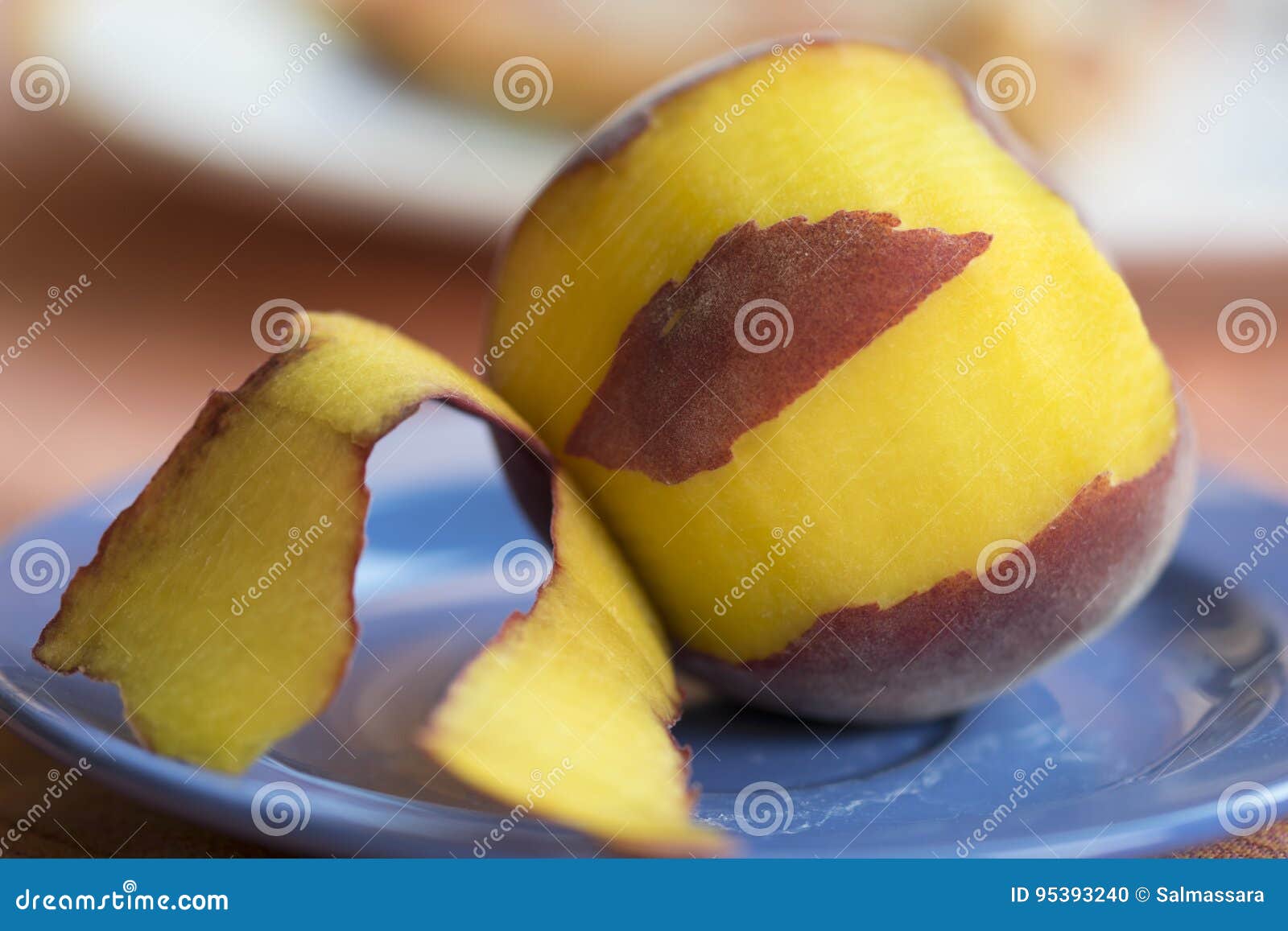 Peeling a fresh peach stock photo. Image of peeling, diet - 95393240