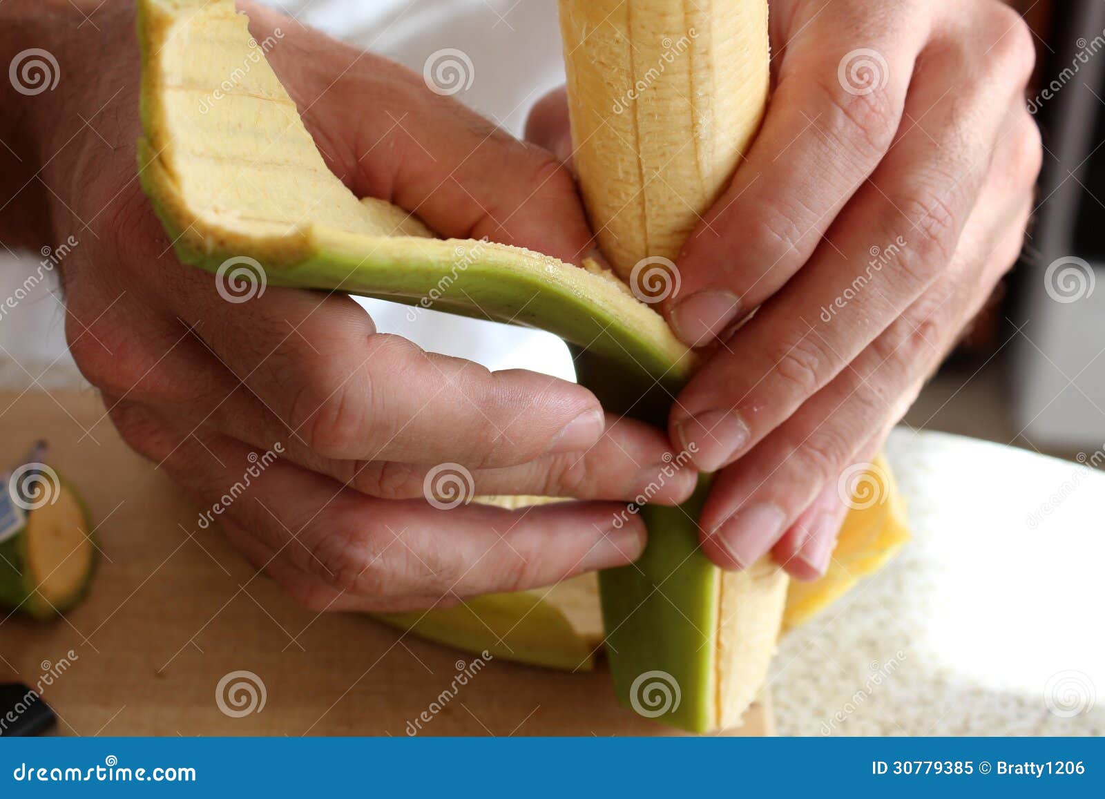 Peeling fresh plantains stock image. Image of peeling - 30779385