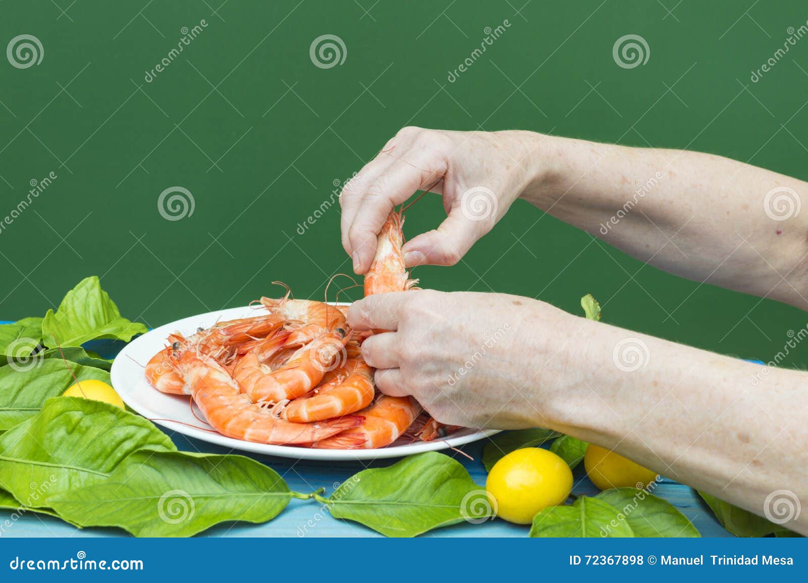 Peeling prawns with hands stock photo. Image of shrimp - 72367898