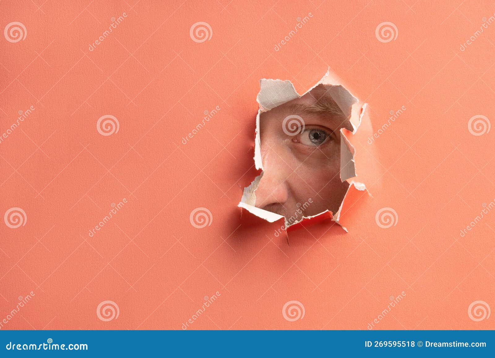 Peep through Torn Paper, Look through a Hole in Paper Stock Photo ...