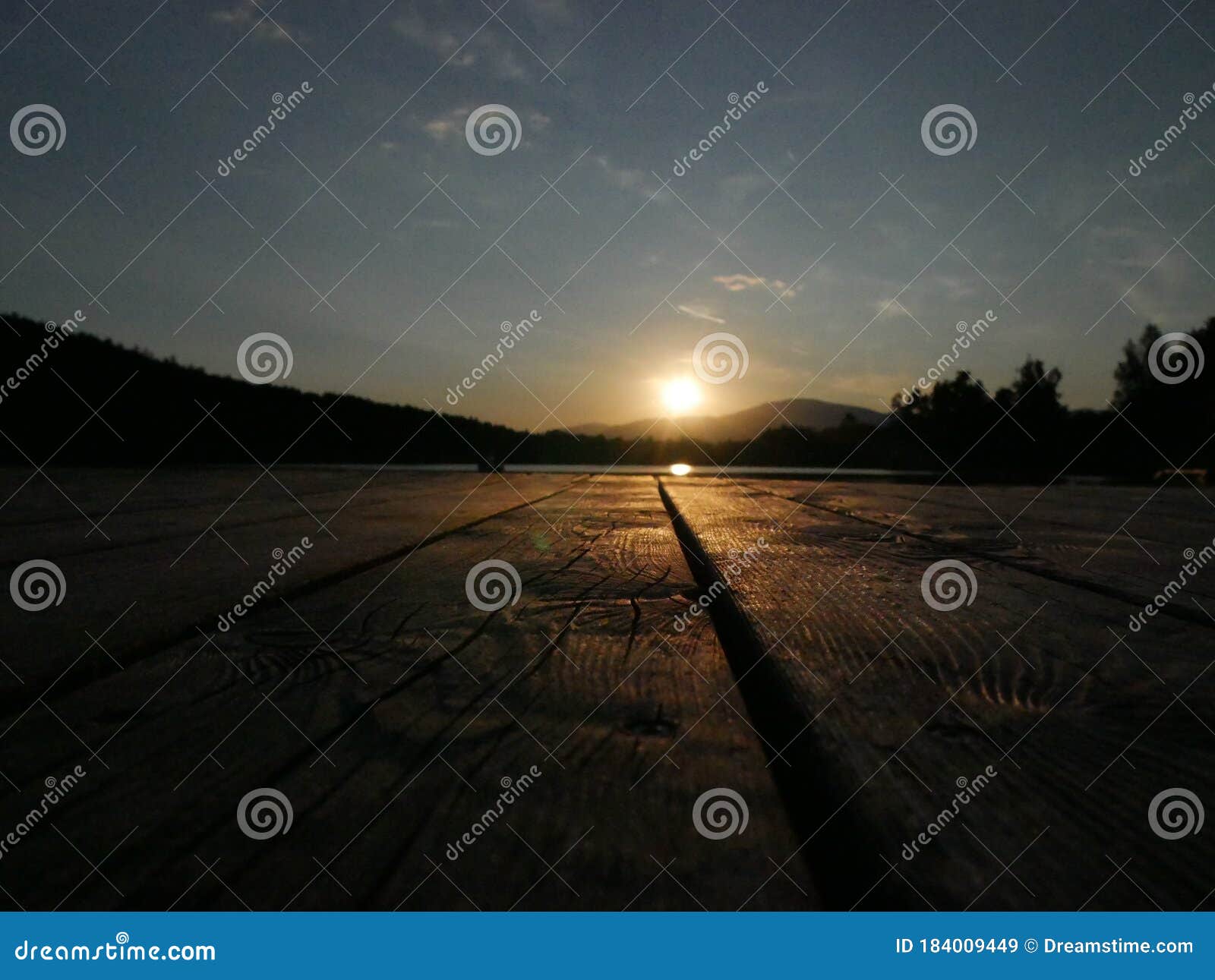 A Peer on a Lake with a Sunset Stock Image - Image of hour, building ...