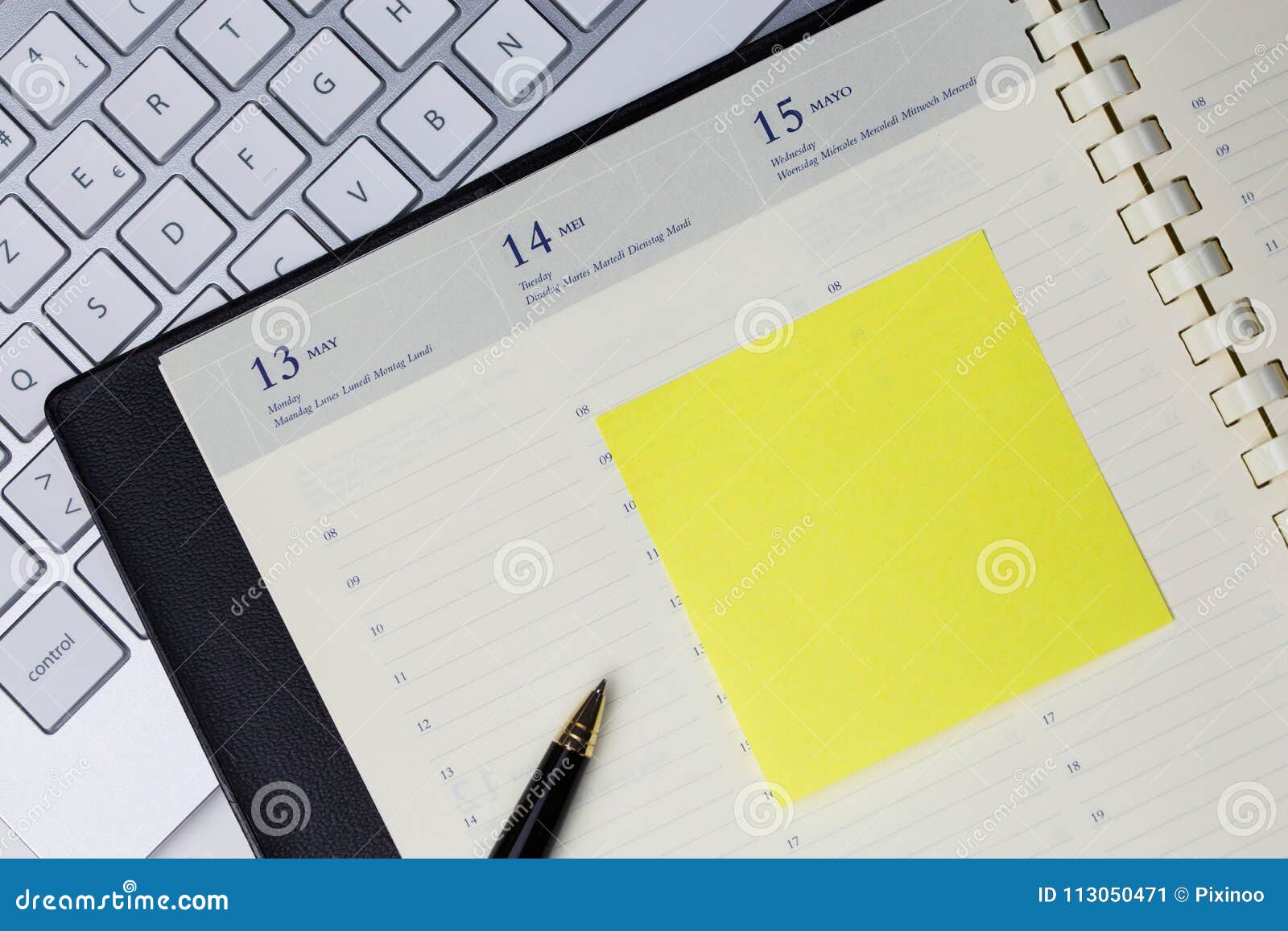 Open Blank Diary with Yellow Sticky Notes and Pen Arranged on a Office ...