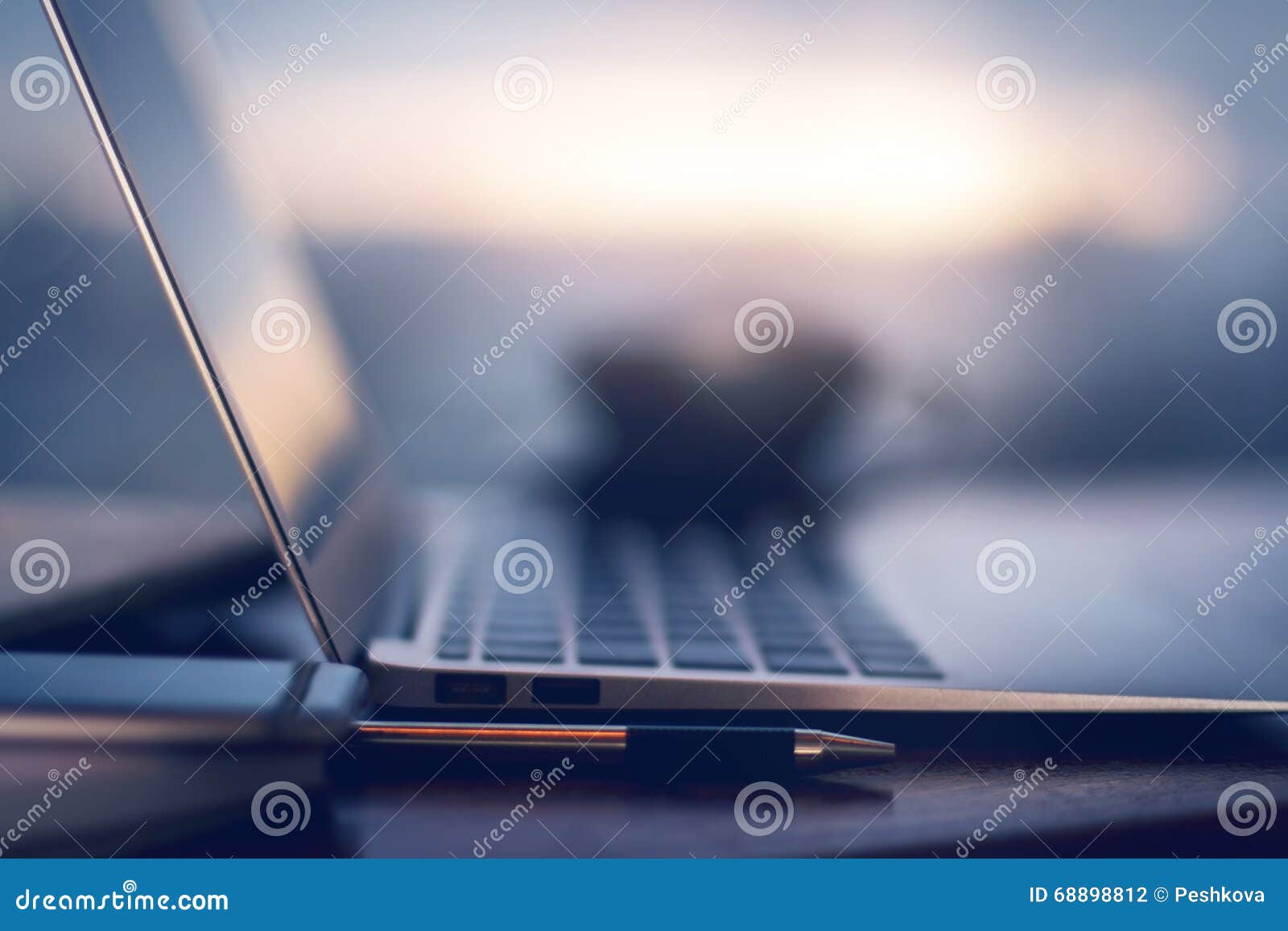 Pen and blurry laptop stock photo. Image of office, daylight - 68898812