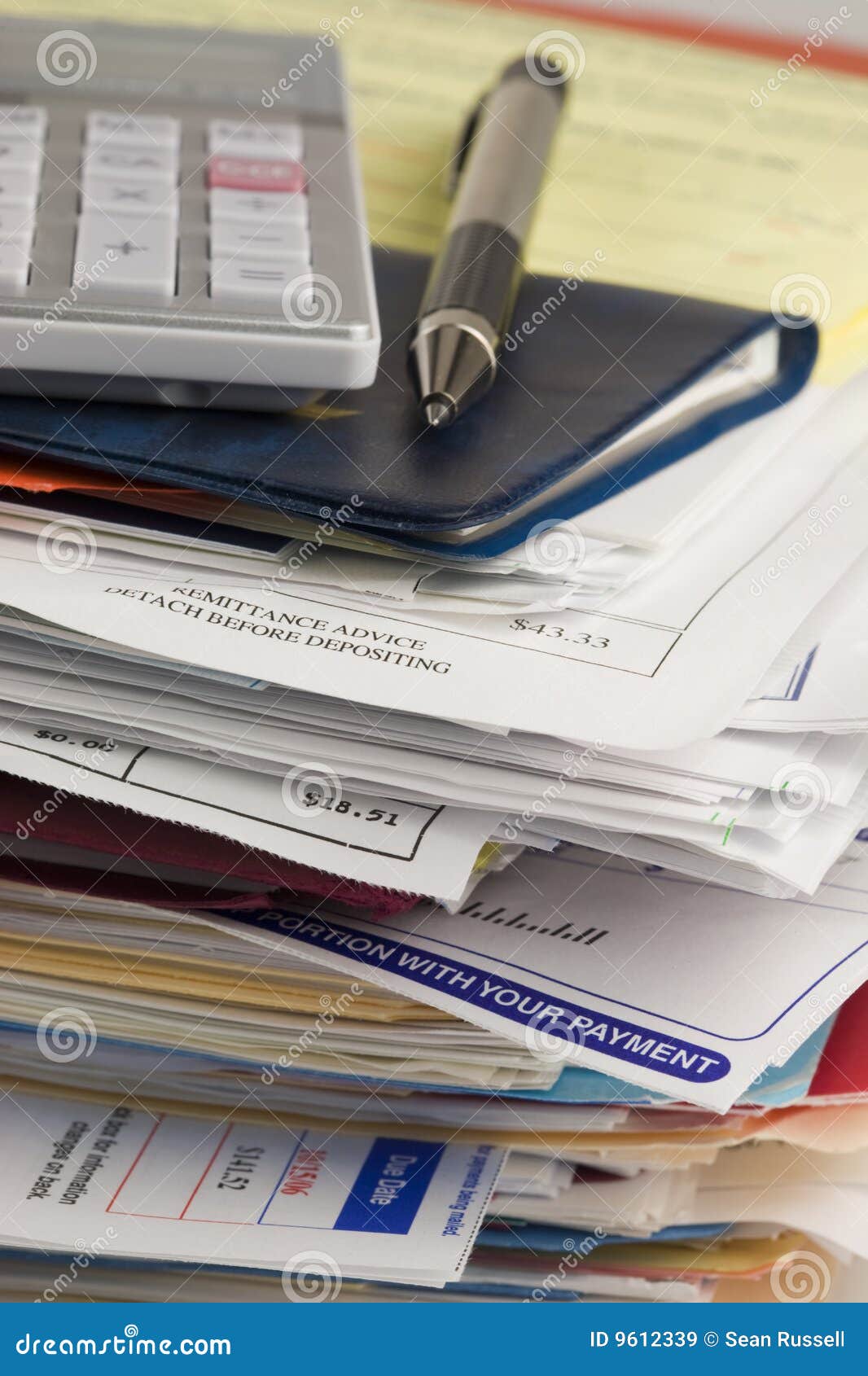 Pen, Calculator and Check Book on a Stack of Bills Stock Image - Image ...