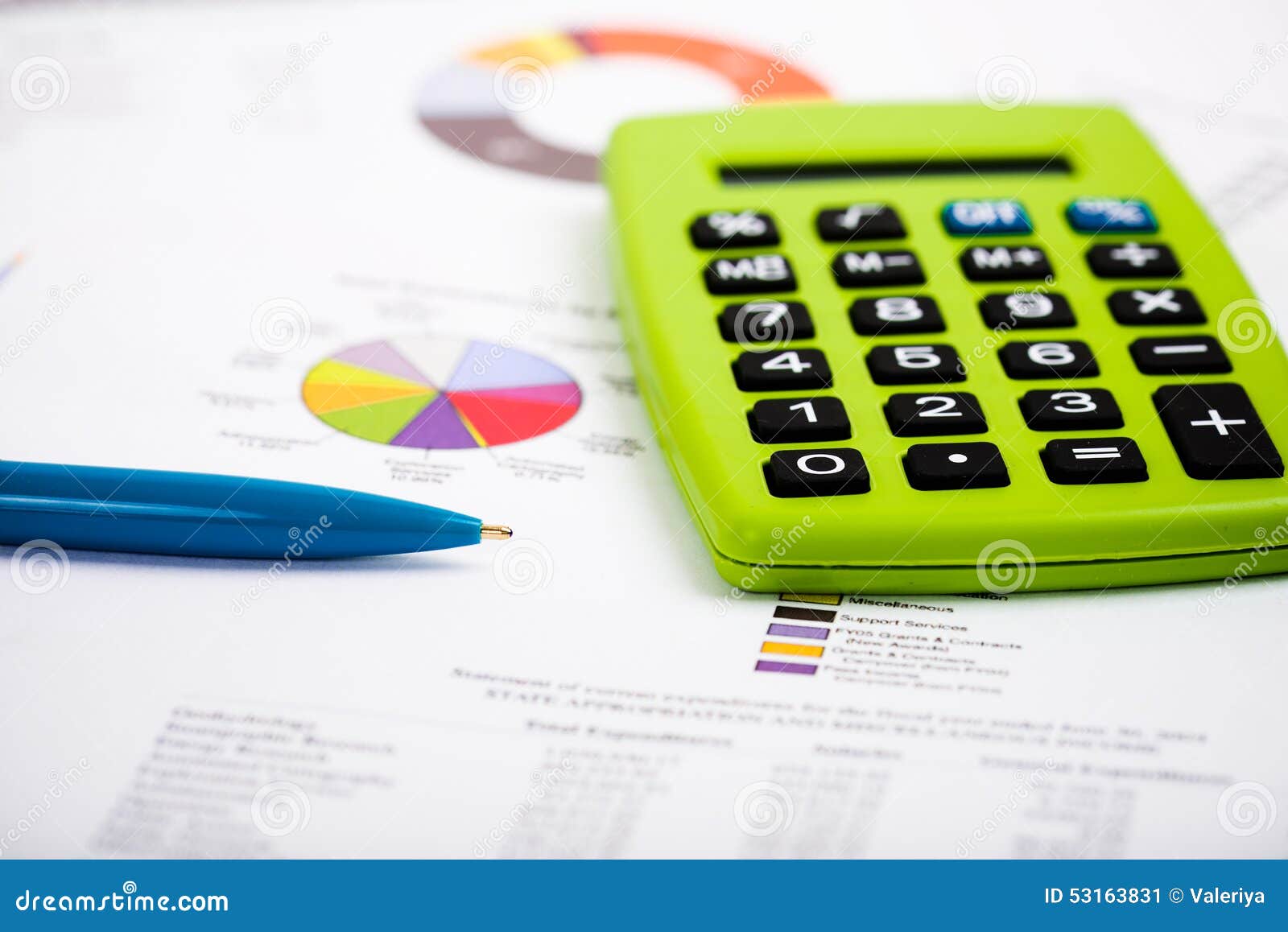 Pen and Calculator on a Paper with Graph and Charts. Stock Image ...