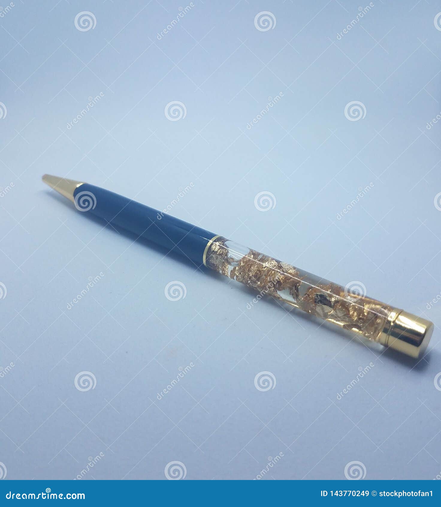 Pen with Gold Flakes or Nuggets on White Background Stock Image - Image ...