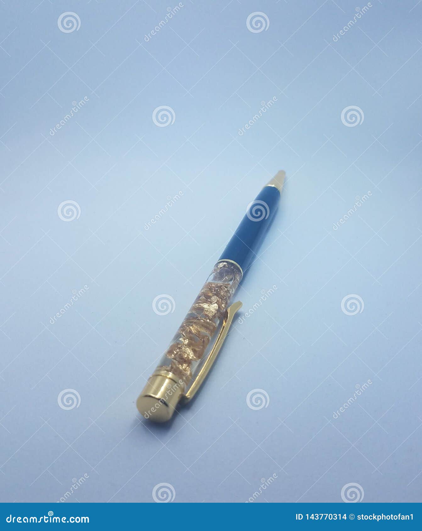Pen with Gold Flakes or Nuggets on White Background Stock Photo - Image ...