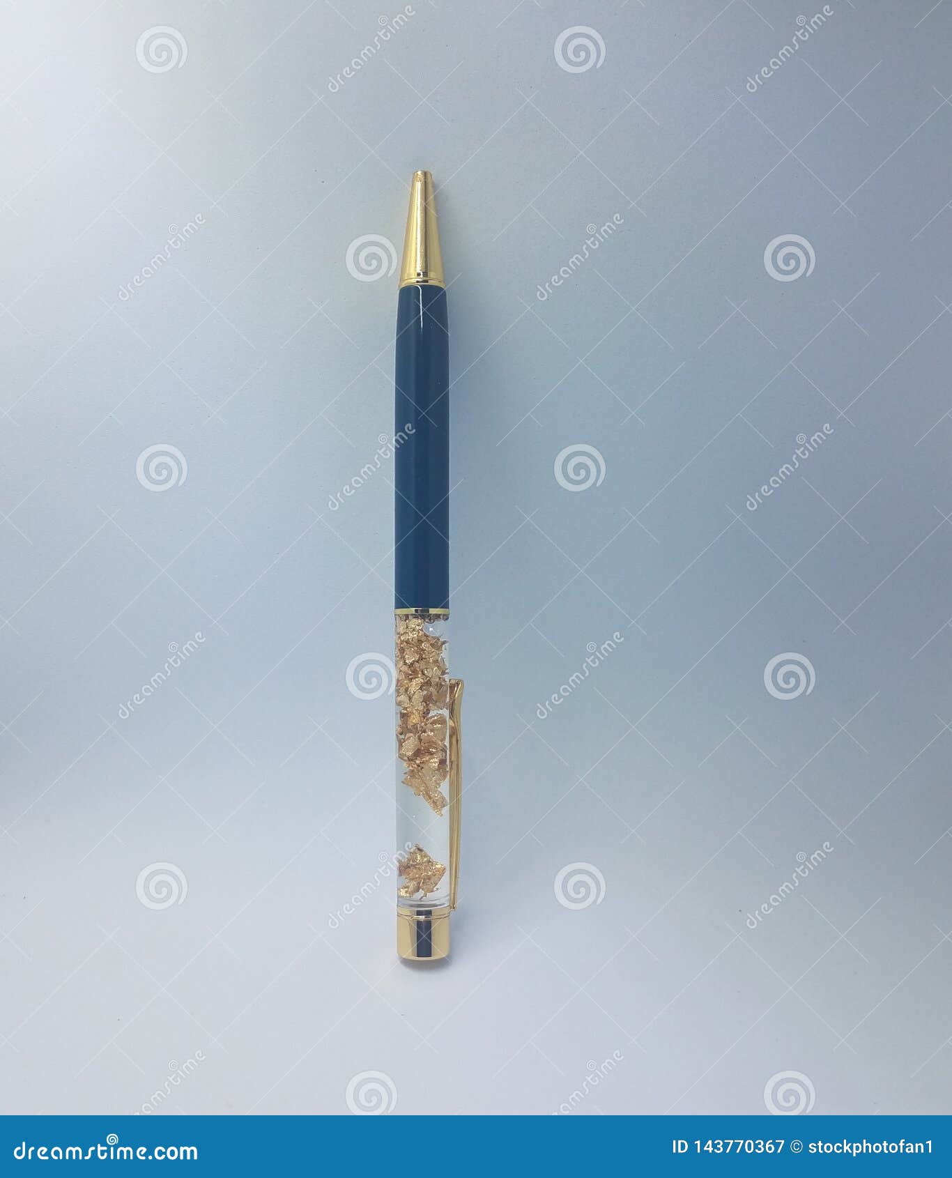 Pen with Gold Flakes or Nuggets on White Background Stock Image - Image ...