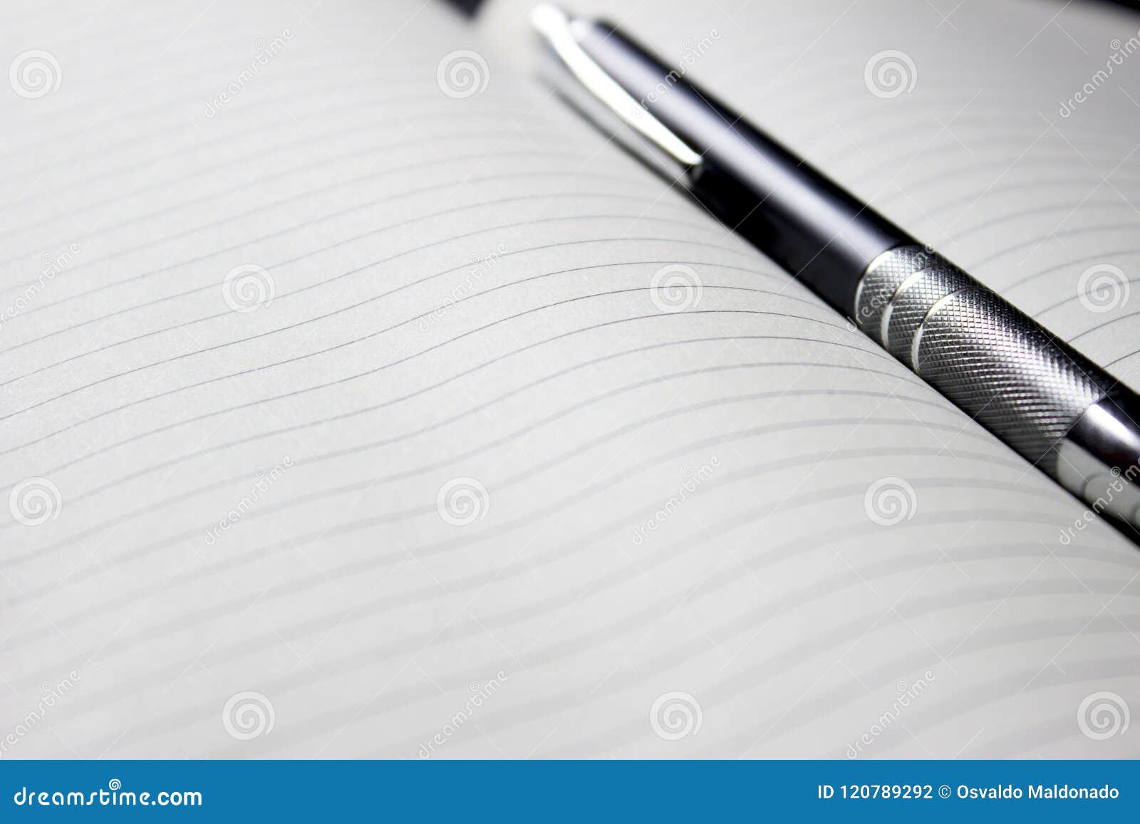 Pen laying over notebook stock photo. Image of pencil - 120789292