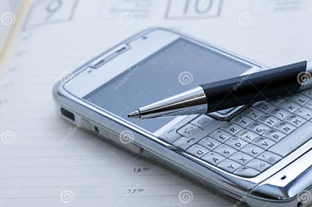 Pen and mobile phone stock photo. Image of notebook, dialing - 20237420