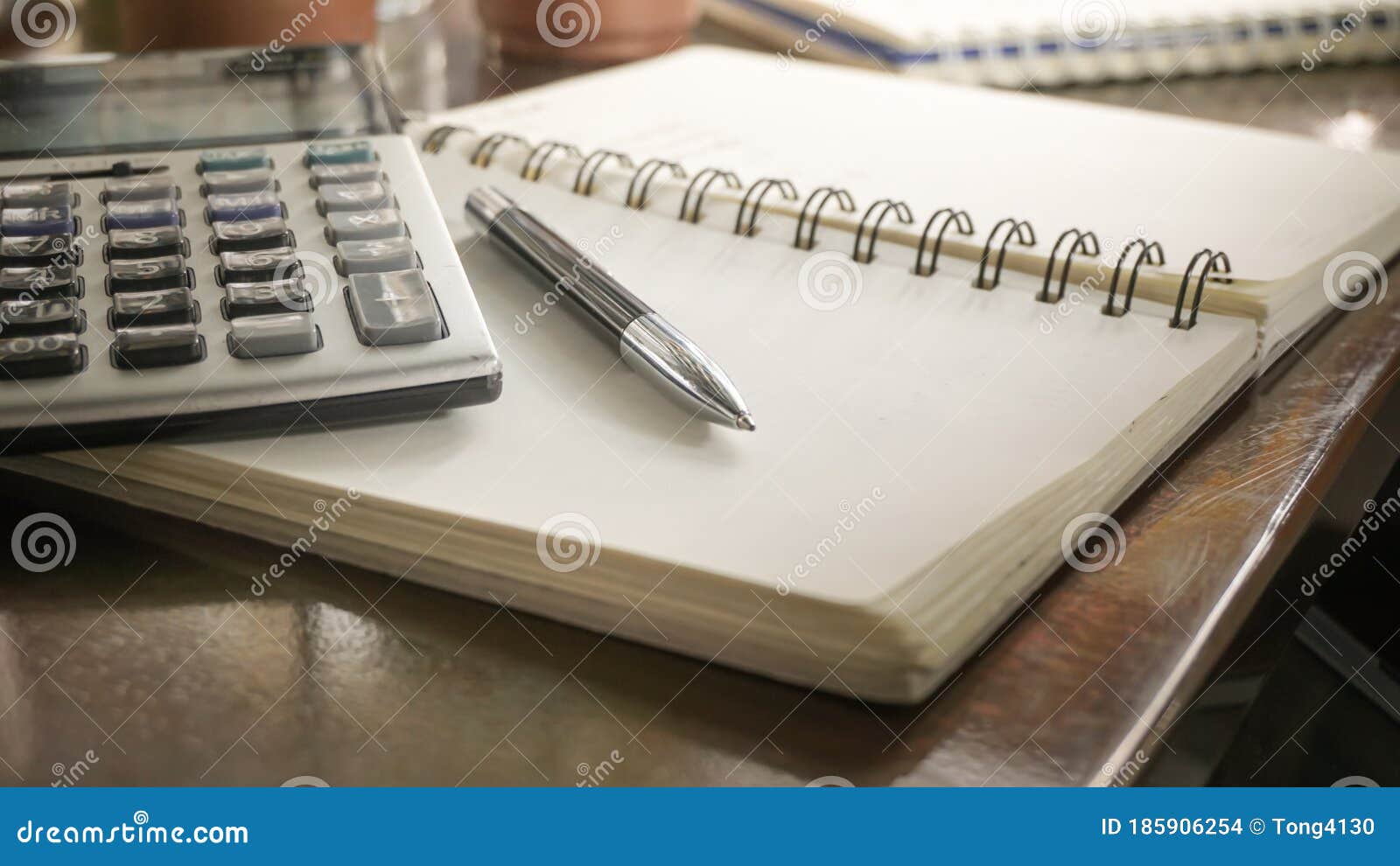 Pen on a Notebook with a Calculator Stock Photo - Image of isolated ...