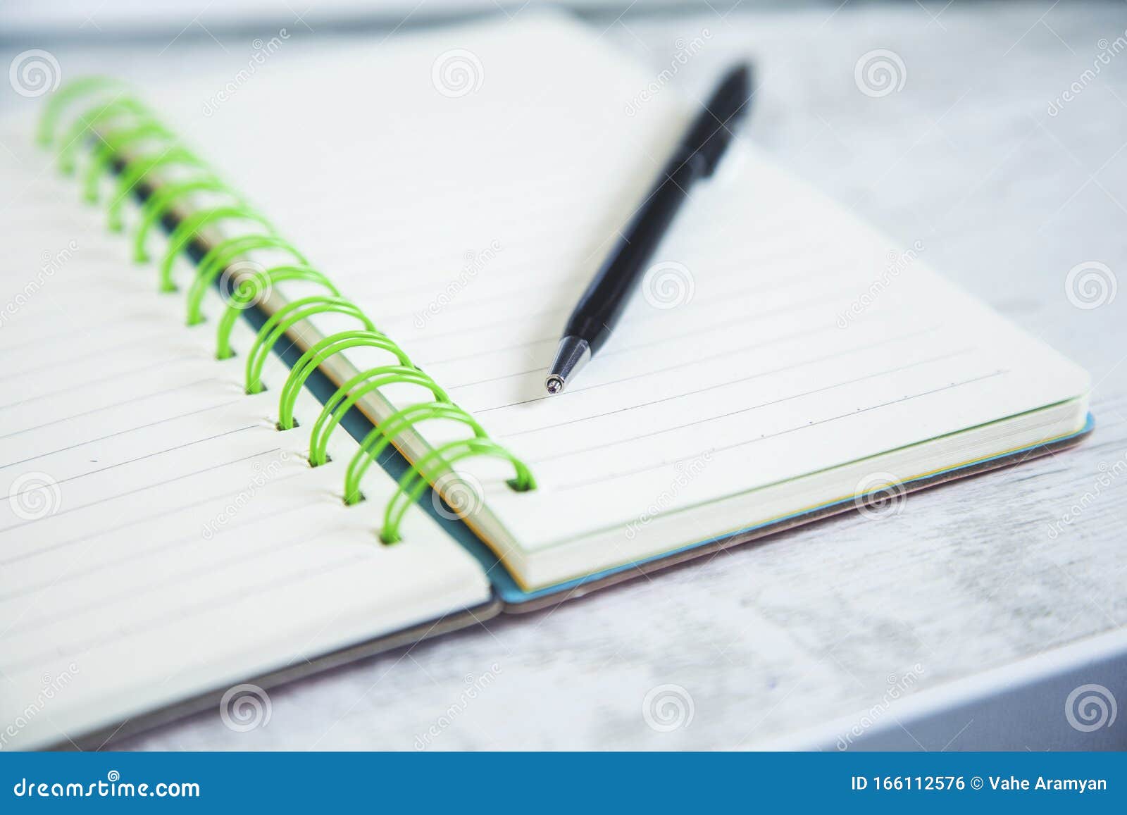 Pen on notepad on desk stock photo. Image of document - 166112576