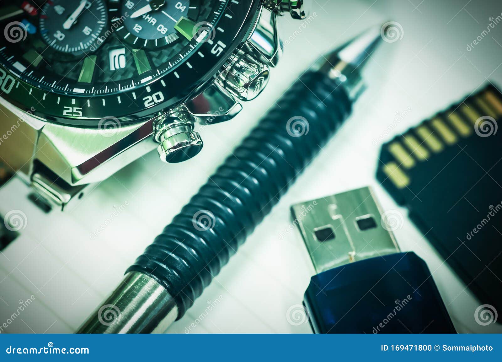 Pen, Notepad, Memory Stick, Memory Card and Men`s Watch on Table Stock ...