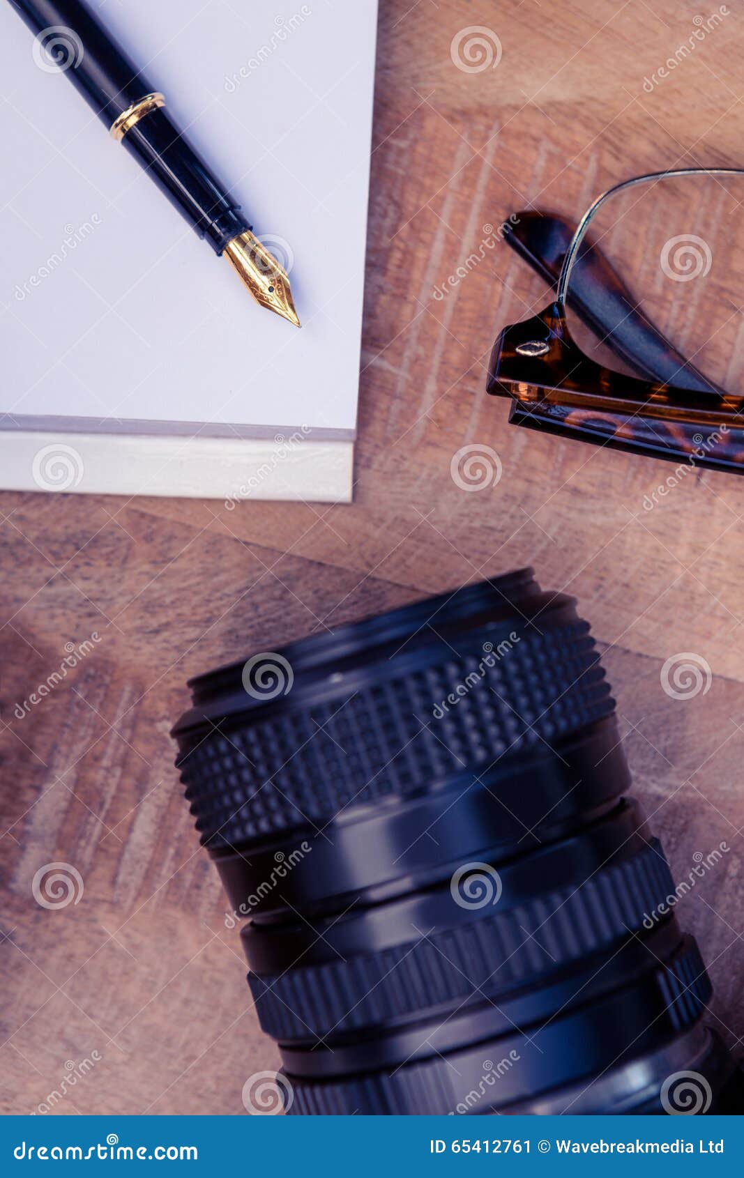Pen on Paper by Camera and Eye Glasses at Desk Stock Image - Image of ...