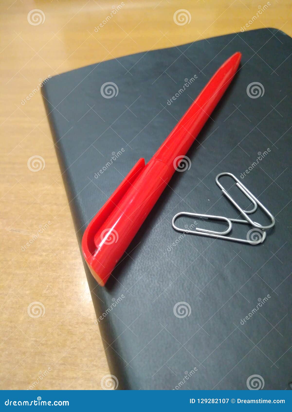 Pen, paper clips, diary. stock image. Image of delicious - 129282107