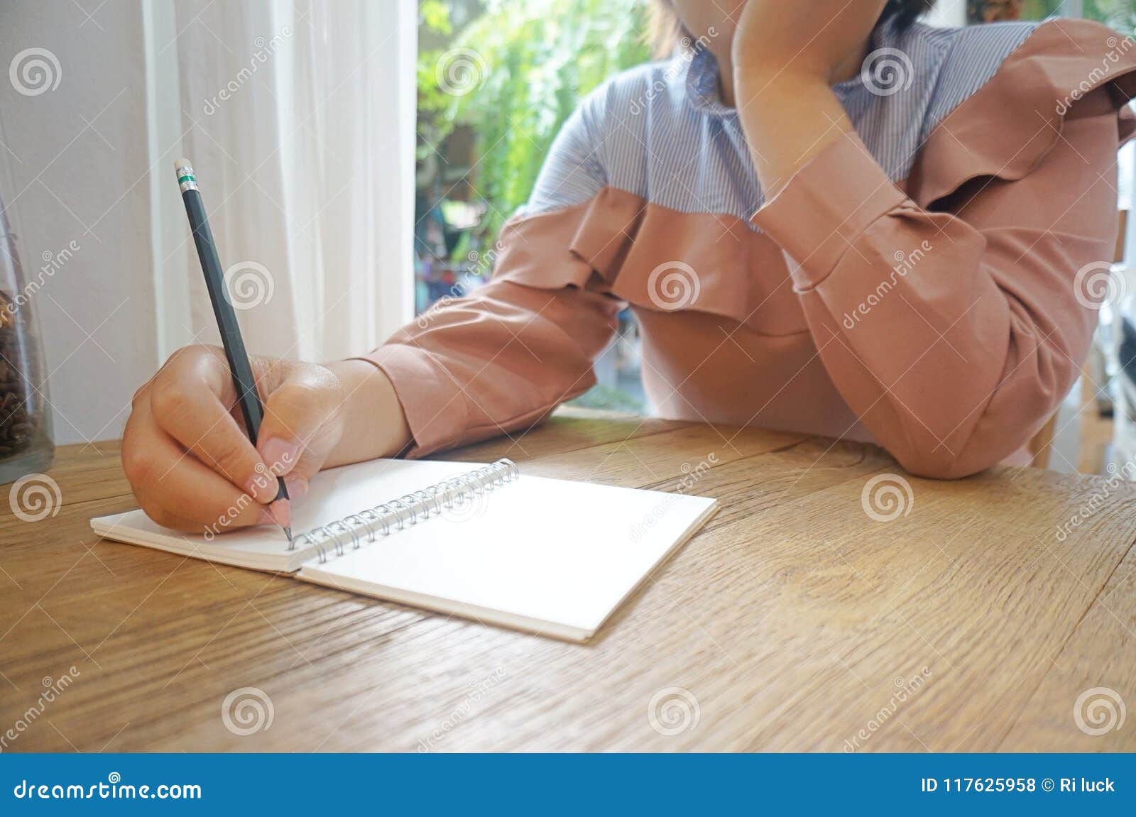 Writing stock photo. Image of woman, book, pencil, table - 117625958