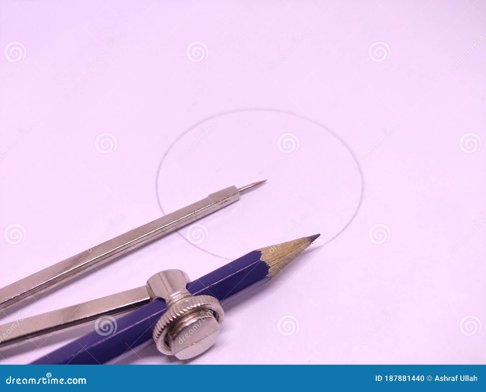Pencil Attached with a Compass and a Circle Painted on White Paper ...