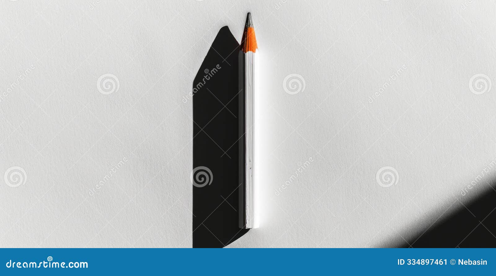 A Pencil Casts a Long, Thin Shadow on a White Surface, Creating a ...