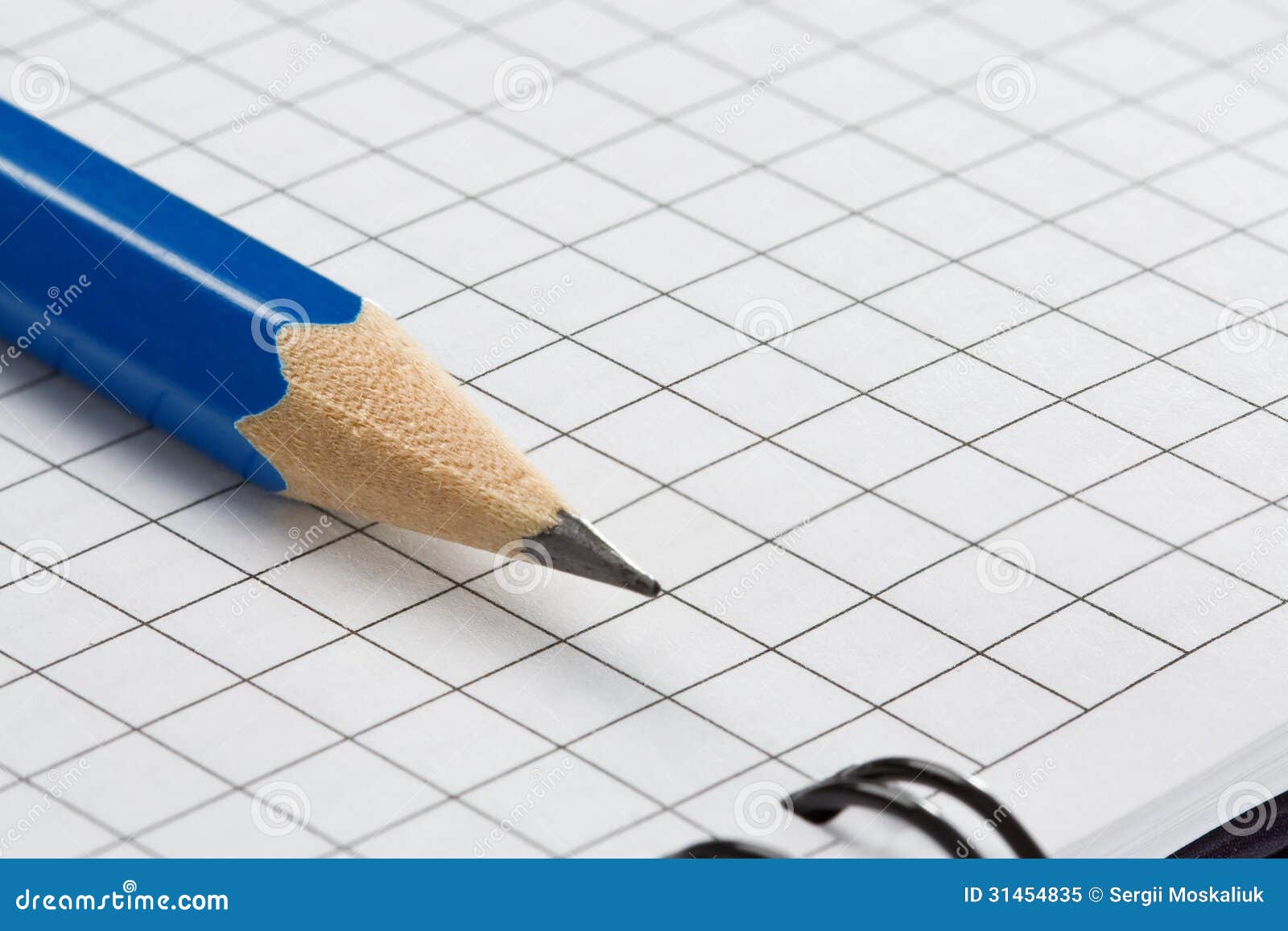 Pencil on checked notebook stock image. Image of checked - 31454835