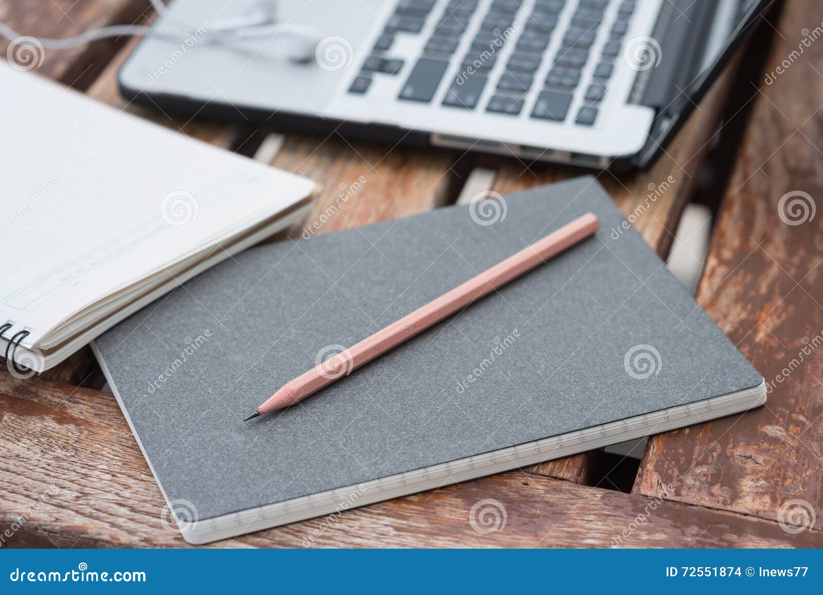 Pencil on a Close Notebook and Laptop on Wood Table. Selective F Stock ...