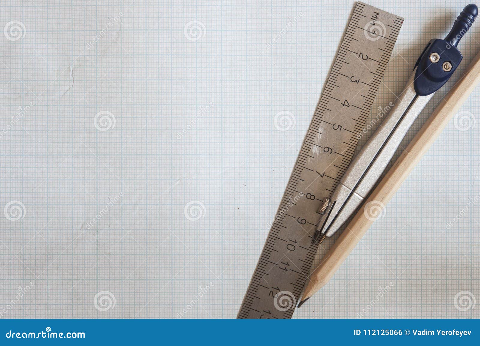 Pencil, Compass and Rulers on Graph Paper Background Stock Photo ...