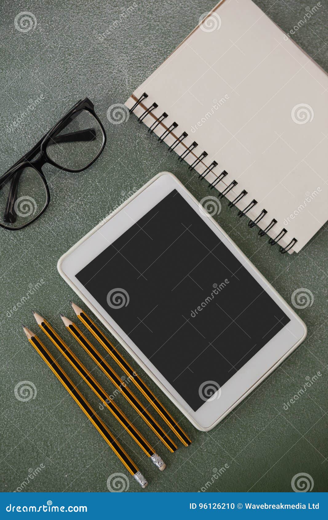 Pencil, Digital Tablet, Spectacles and Book Arranged on Chalkboard ...