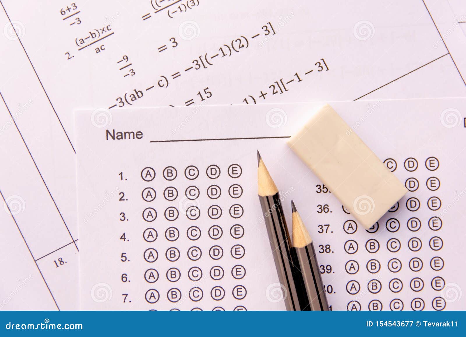 Pencil and Eraser on Answer Sheets or Standardized Test Form with ...
