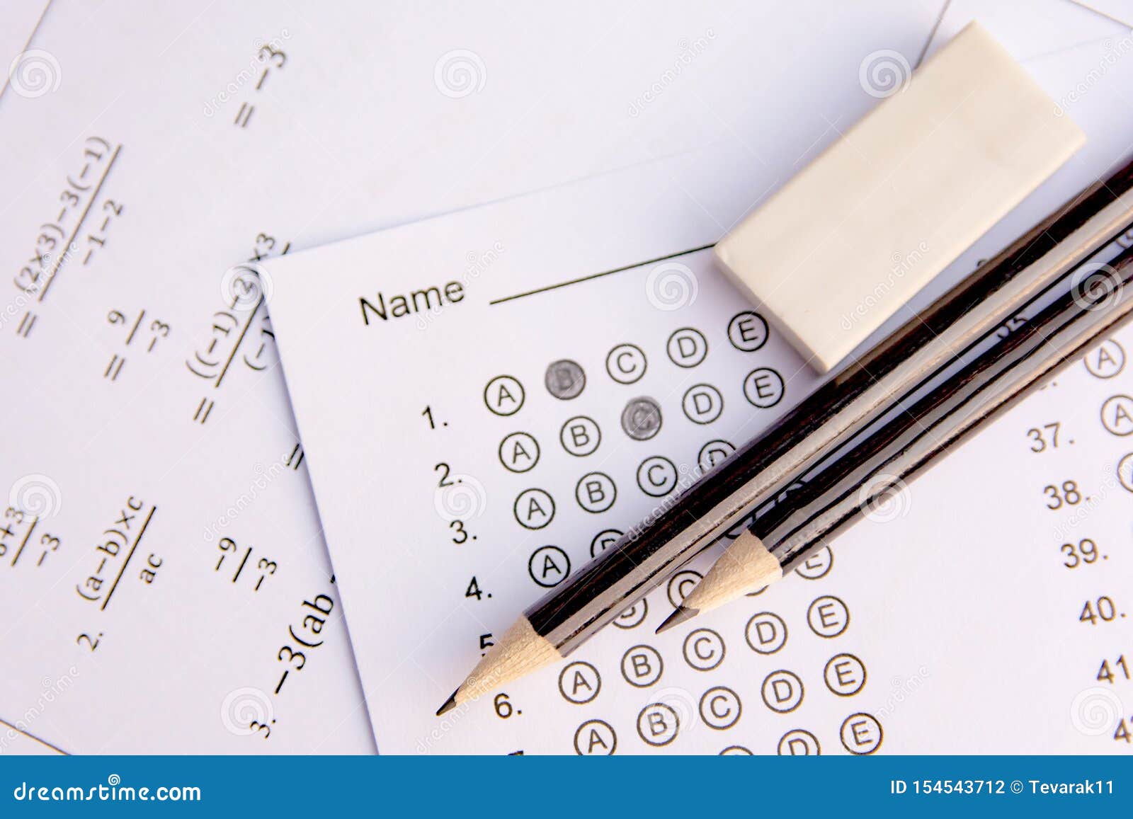 Pencil and Eraser on Answer Sheets or Standardized Test Form with ...