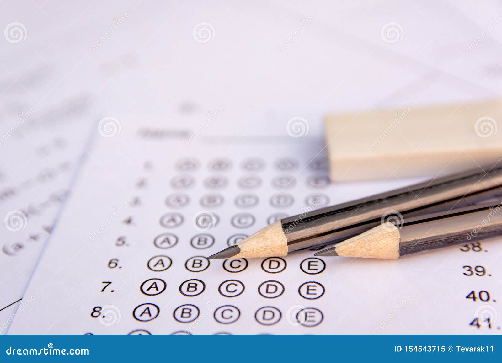 Pencil and Eraser on Answer Sheets or Standardized Test Form with ...