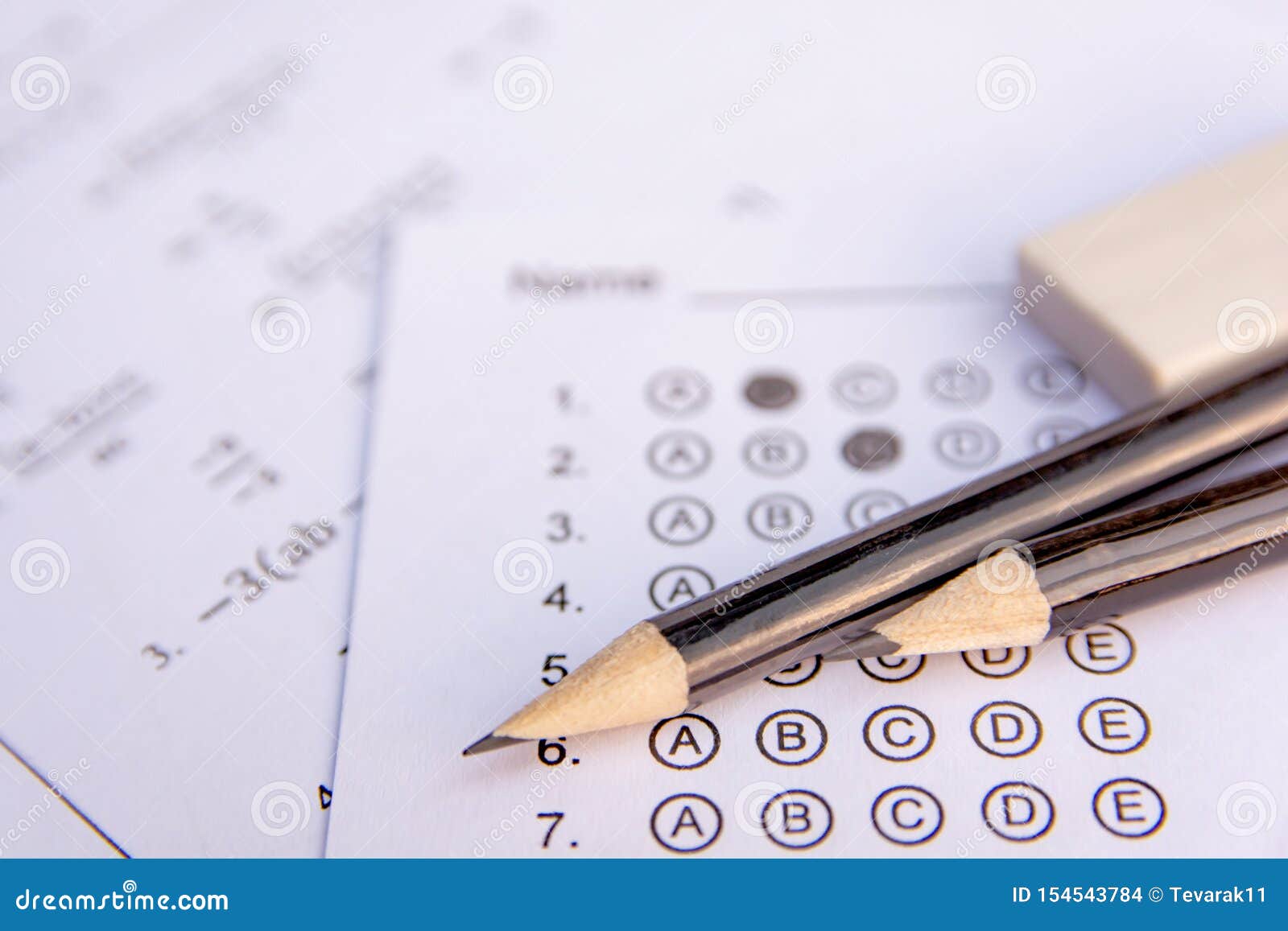 Pencil and Eraser on Answer Sheets or Standardized Test Form with ...