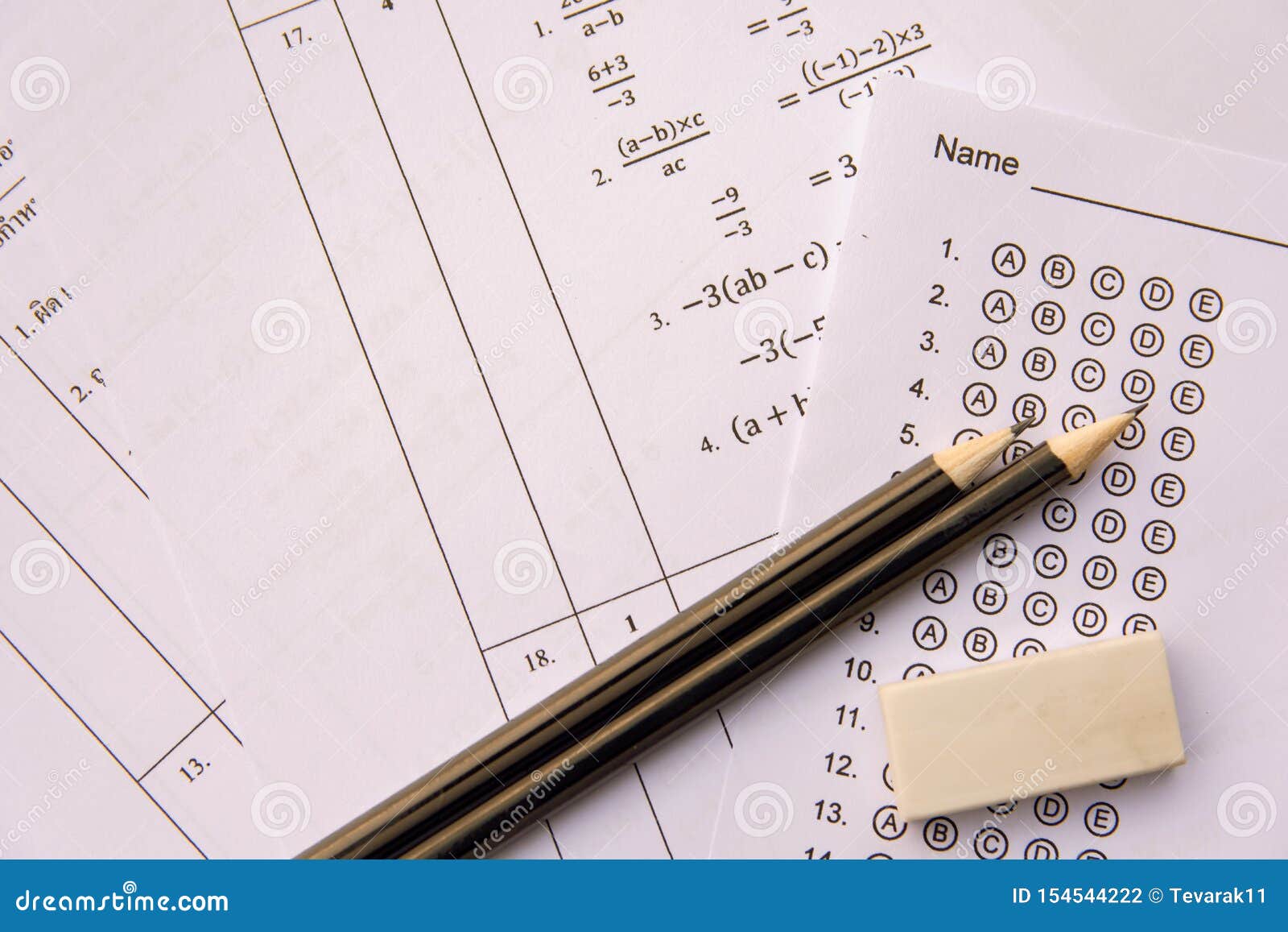 Pencil and Eraser on Answer Sheets or Standardized Test Form with ...