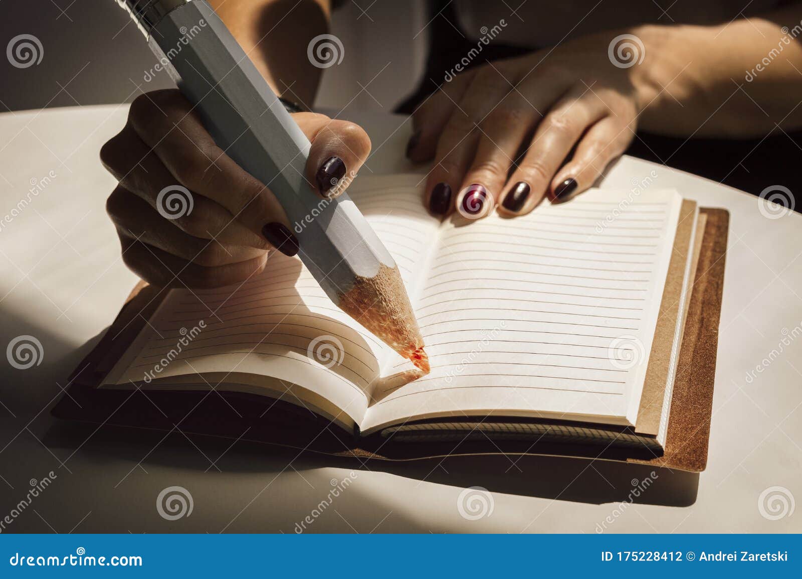 Pencil with a Fire Stylus is on a Sheet of a Notebook. the Concept of ...