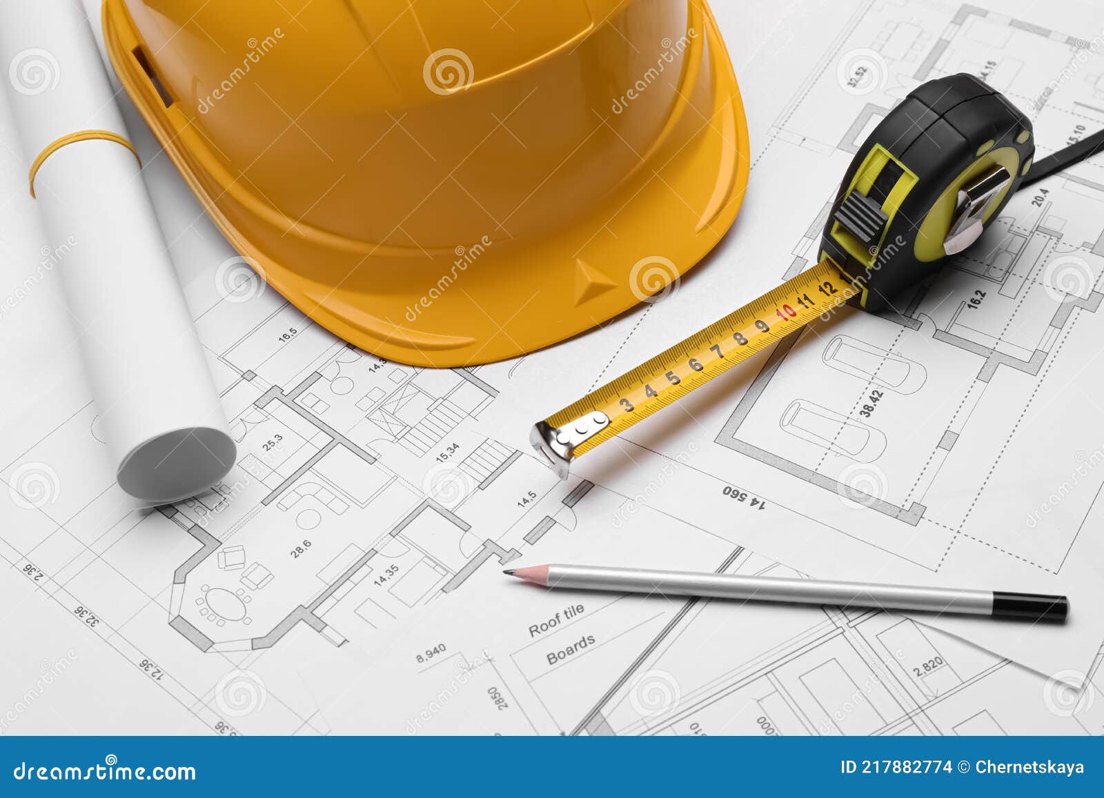 Pencil, Measuring Tape and Hardhat on Blueprints Stock Photo - Image of ...