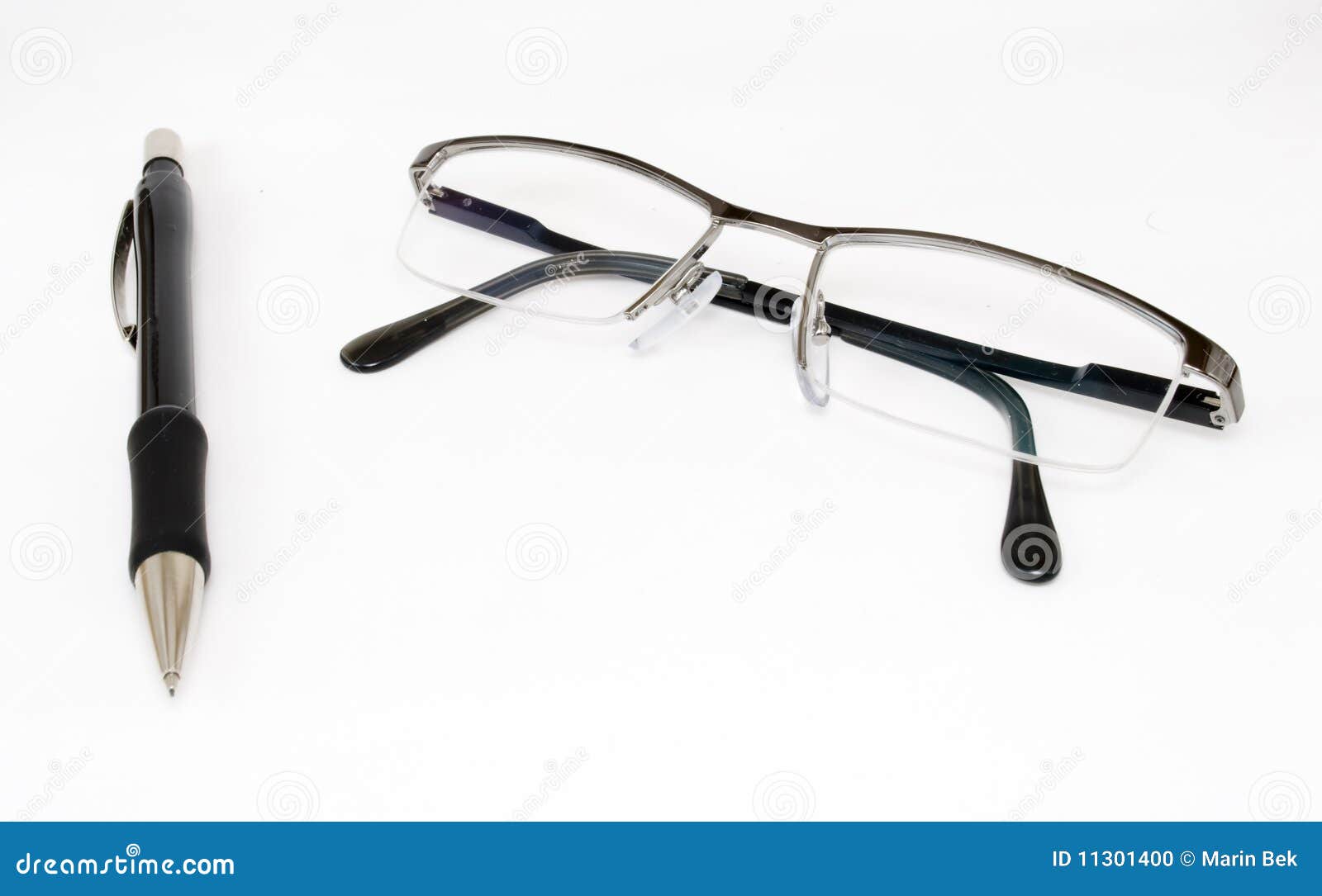 A Pencil and Reading Glasses Stock Photo - Image of headline, market ...