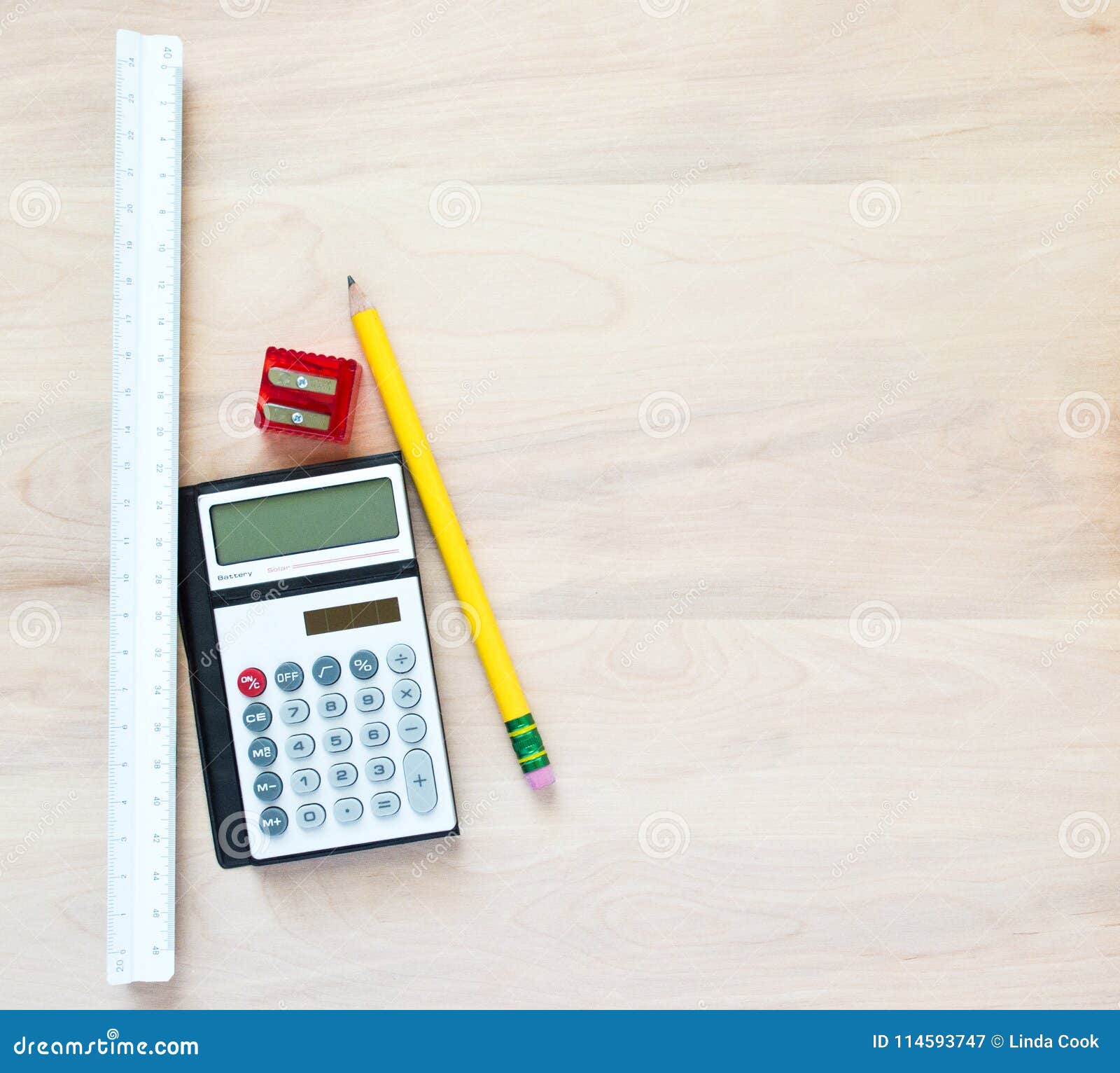 1 Pencil, a Pencil Sharpener, a Calculator and a Triangular Ruler on a ...