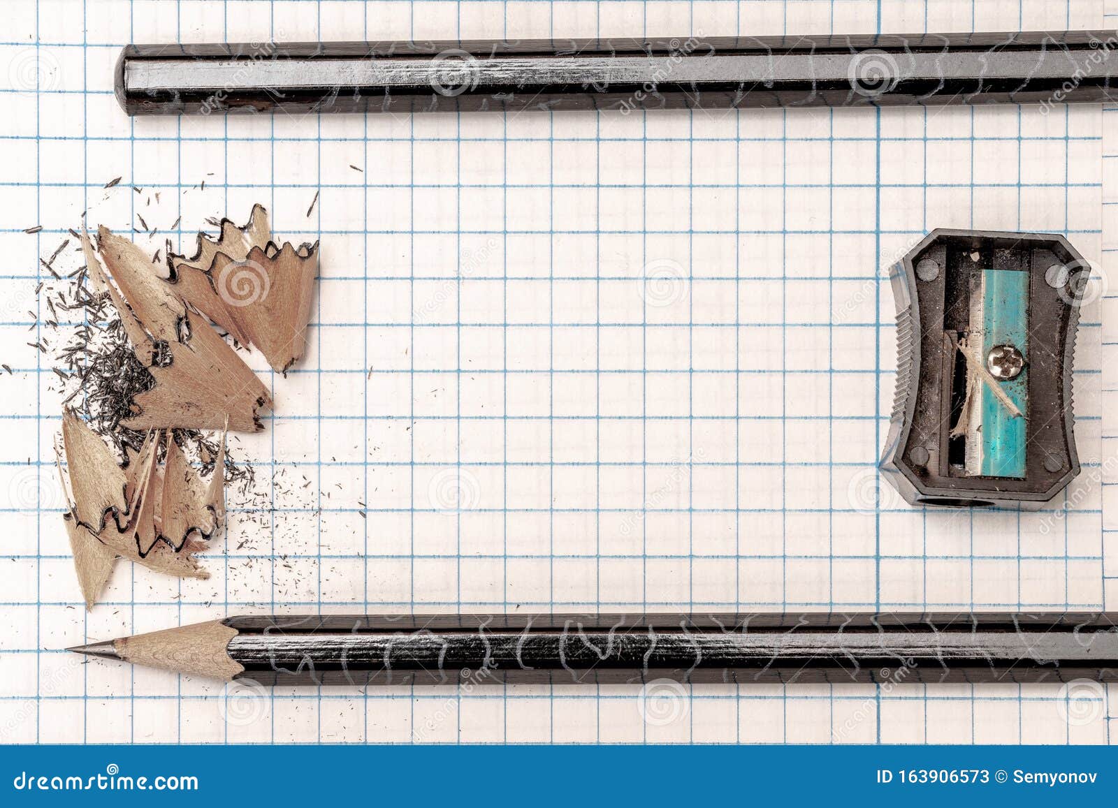 Pencil Sharpener and Pencils on Squared Paper. Top View with Space for ...